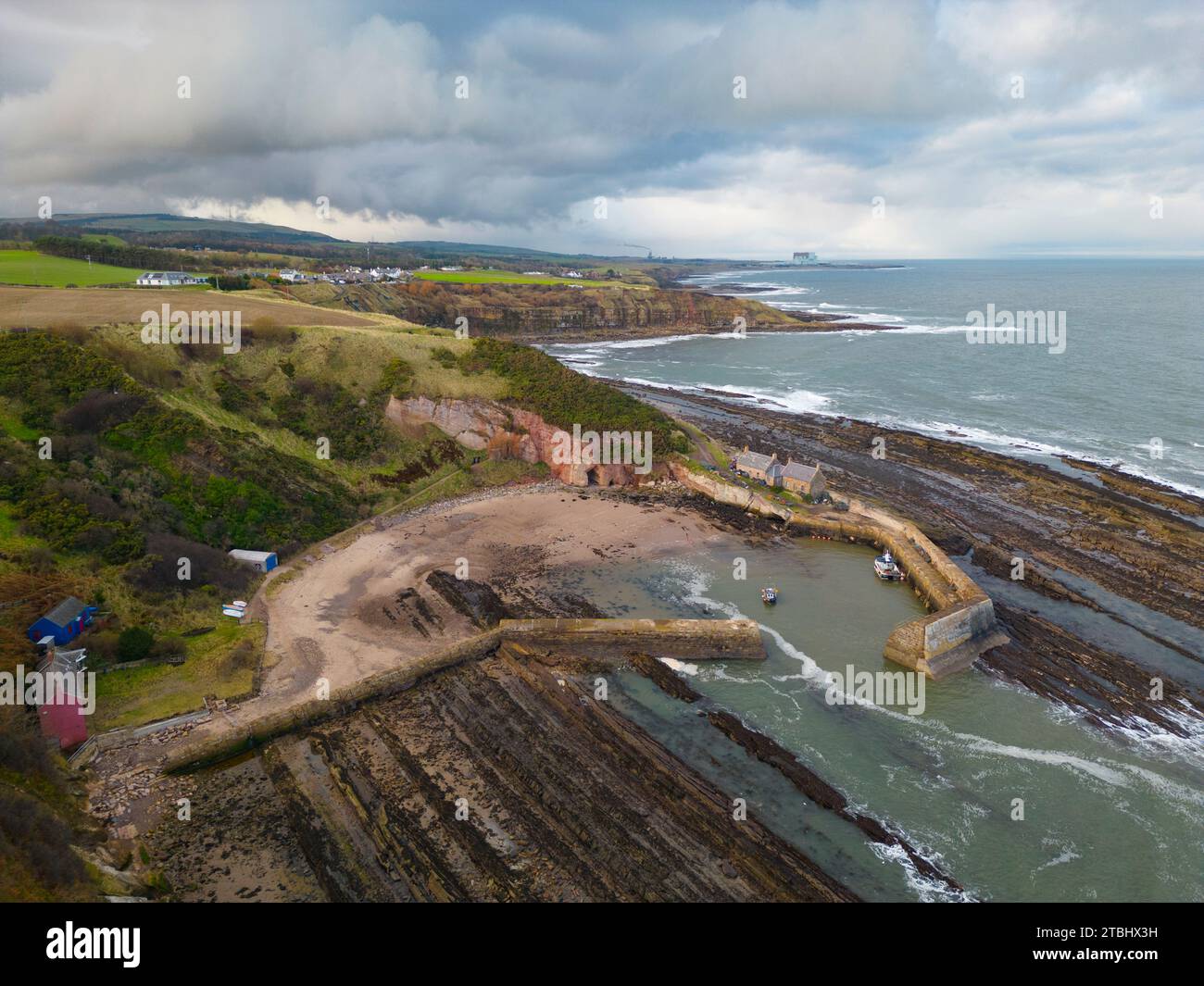 Aerial view of Cove harbour and coastline in Scottish Borders, Scotland ...