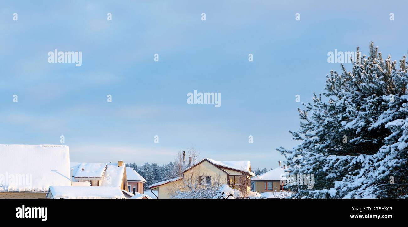 Winter rural landscape. Snow-covered conifers, cottages. Russia ...