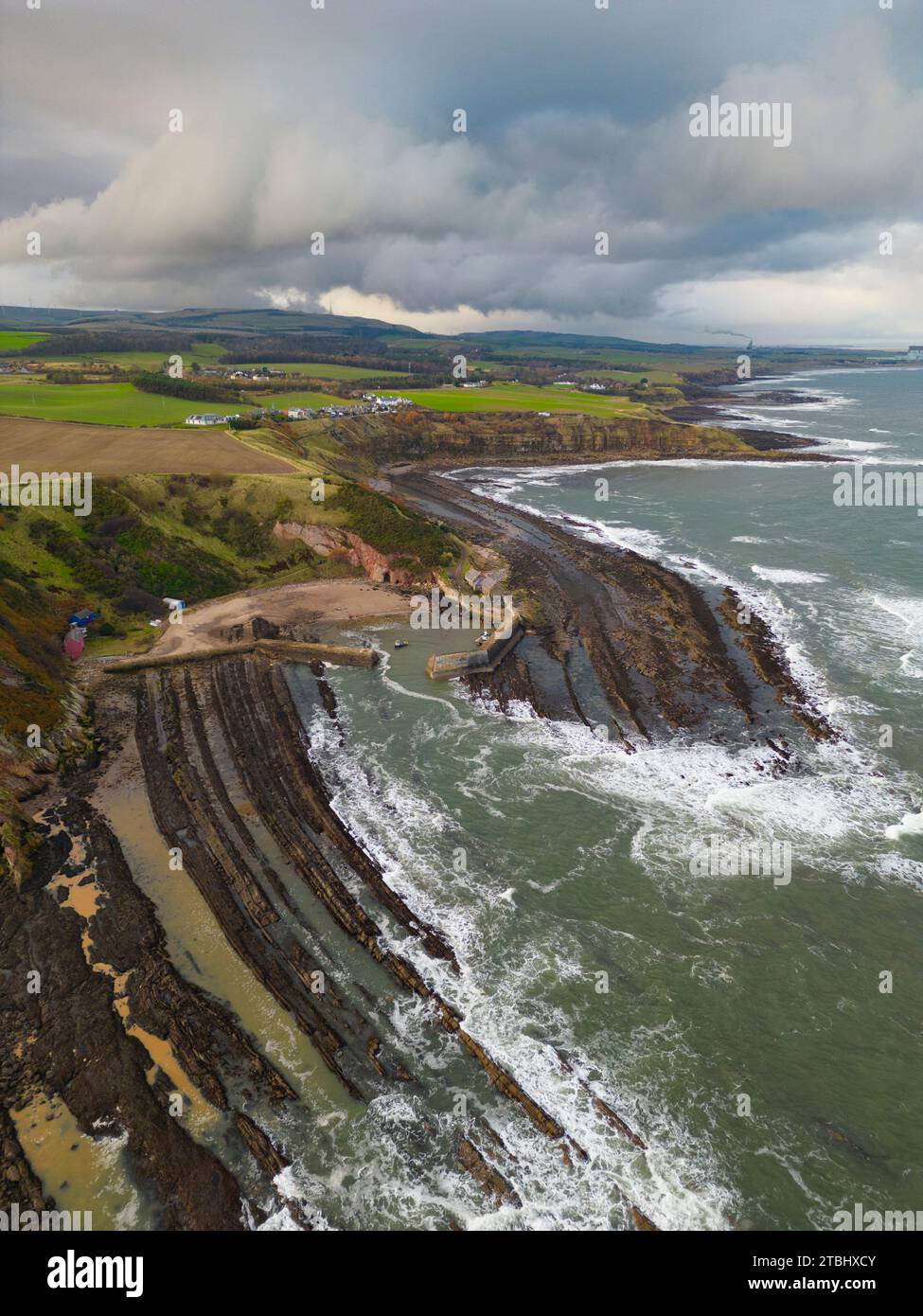Aerial view of Cove harbour and coastline in Scottish Borders, Scotland ...