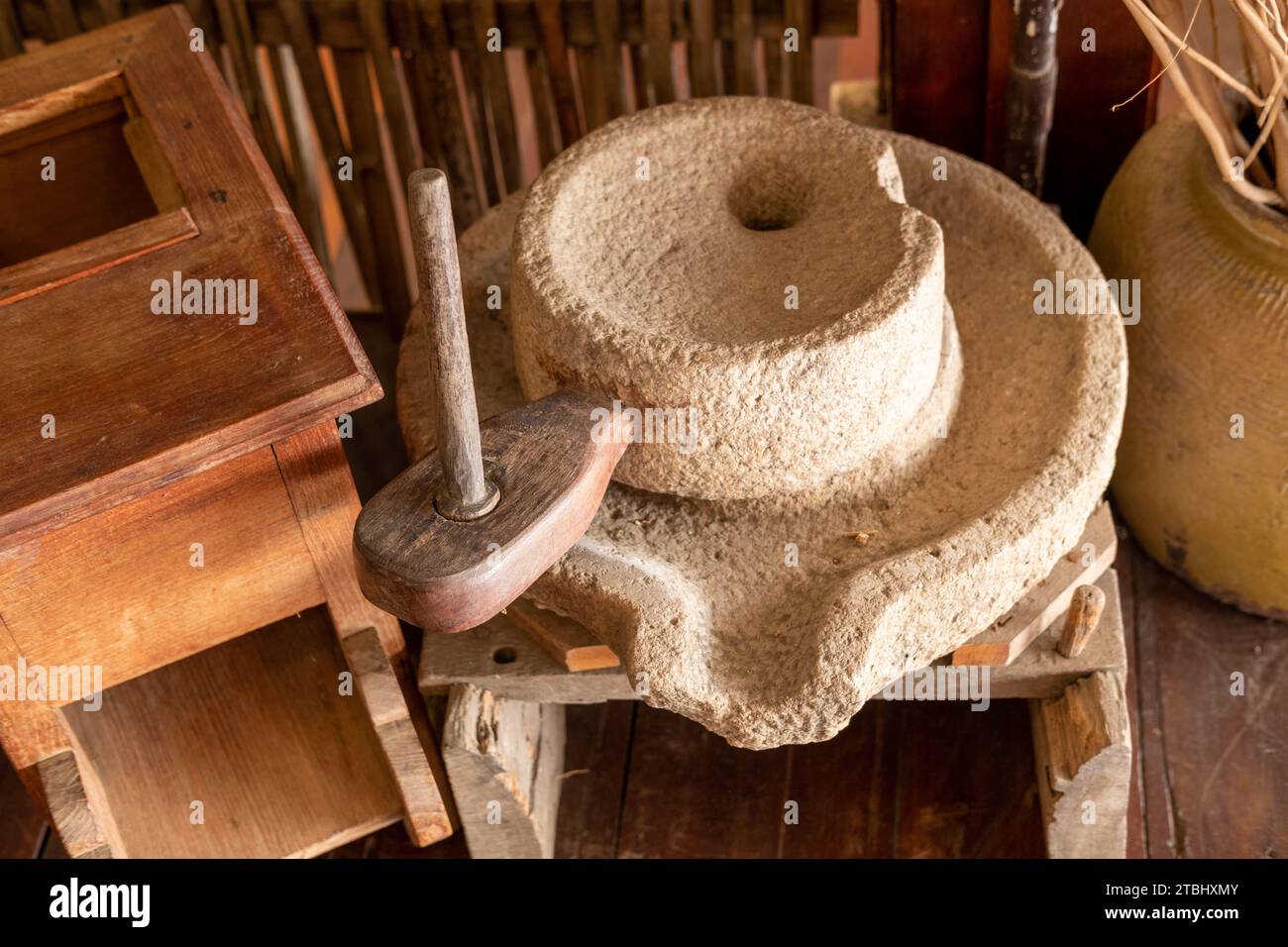 An old manual stone flour mill used in traditional Asian kitchens Stock ...