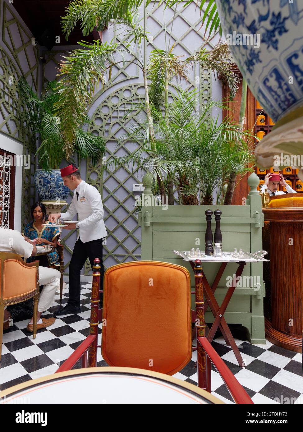 Bacha Coffee Cafe inside Dar el Bacha Palace. Staff member with Fez hat ...