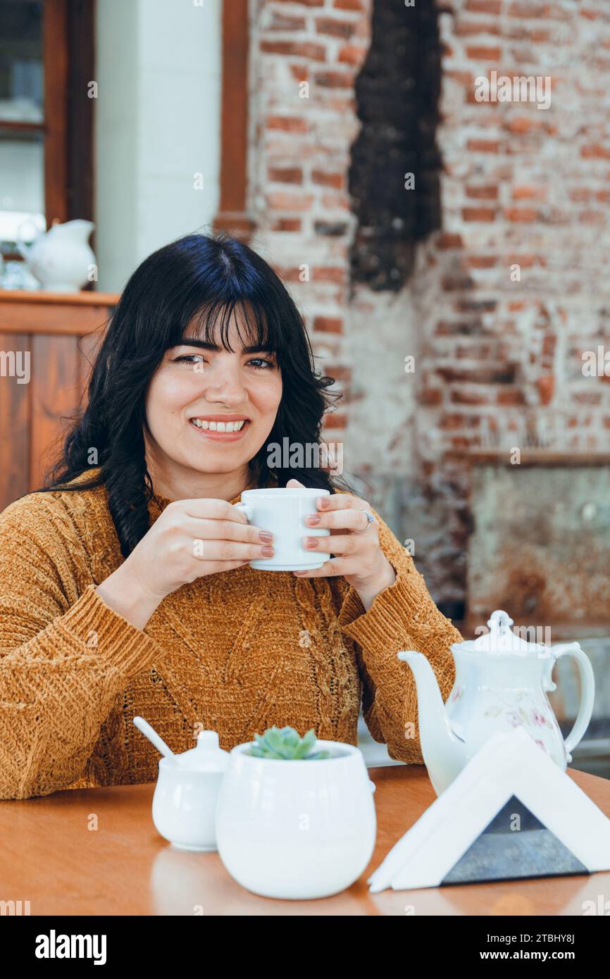 vertical image of young Venezuelan Latin woman, out for walk in Buenos ...