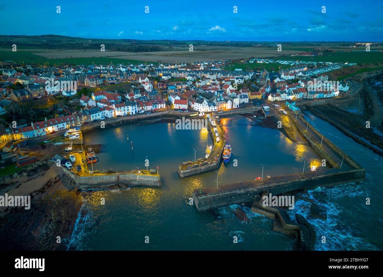 Aerial view at night of St Monans fishing village harbour in East Neuk ...