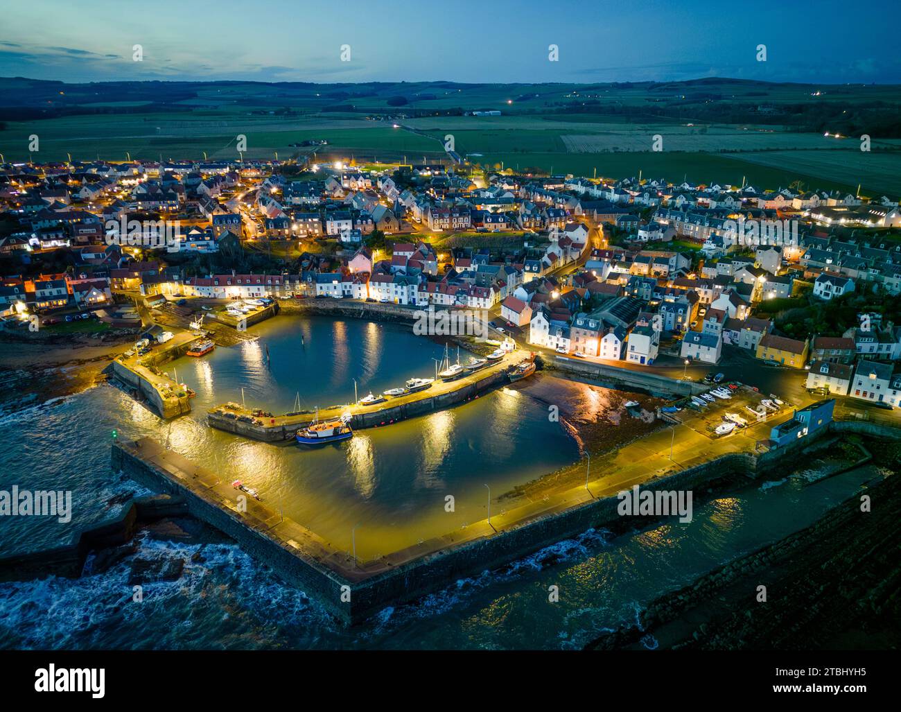 Aerial view at night of St Monans fishing village harbour in East Neuk ...