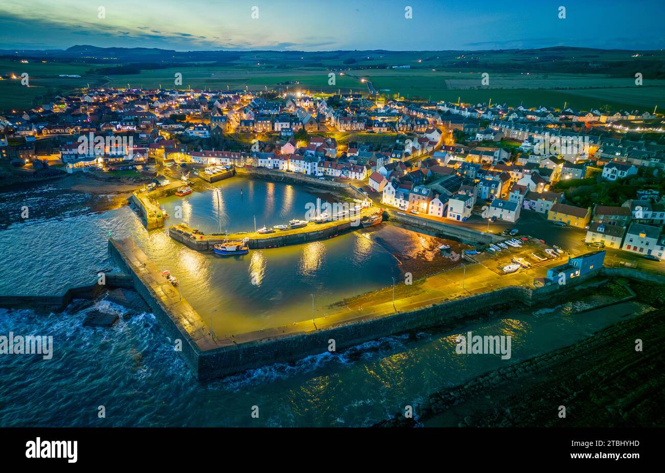 Aerial view at night of St Monans fishing village harbour in East Neuk ...