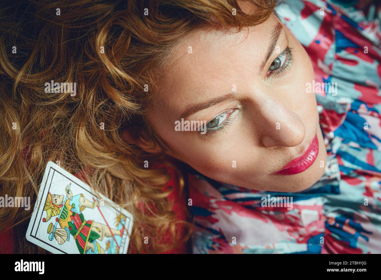 an elegant and beautiful adult Latina tarot reader woman with green ...