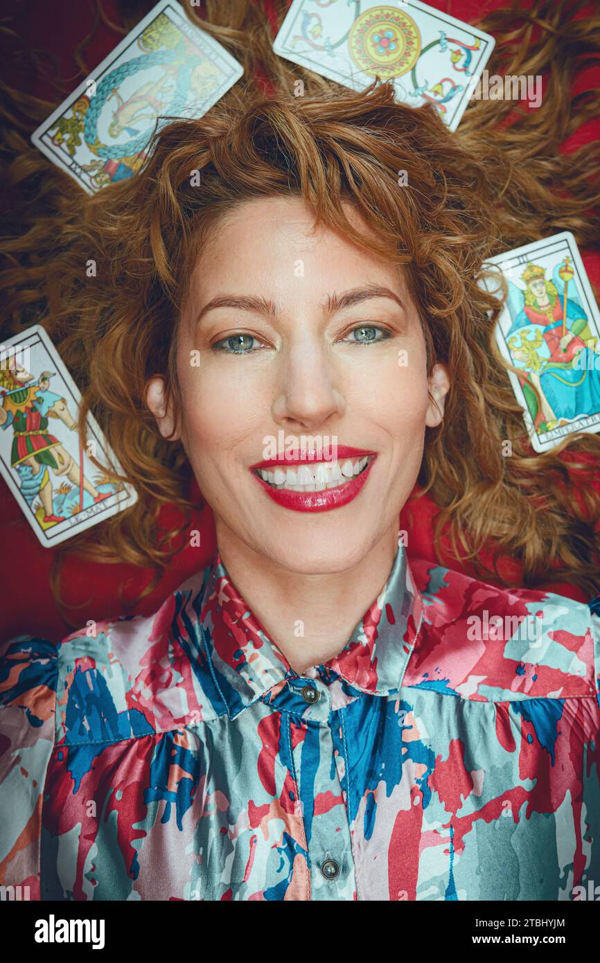 portrait of beautiful happy tarot reader woman smiling looking at ...