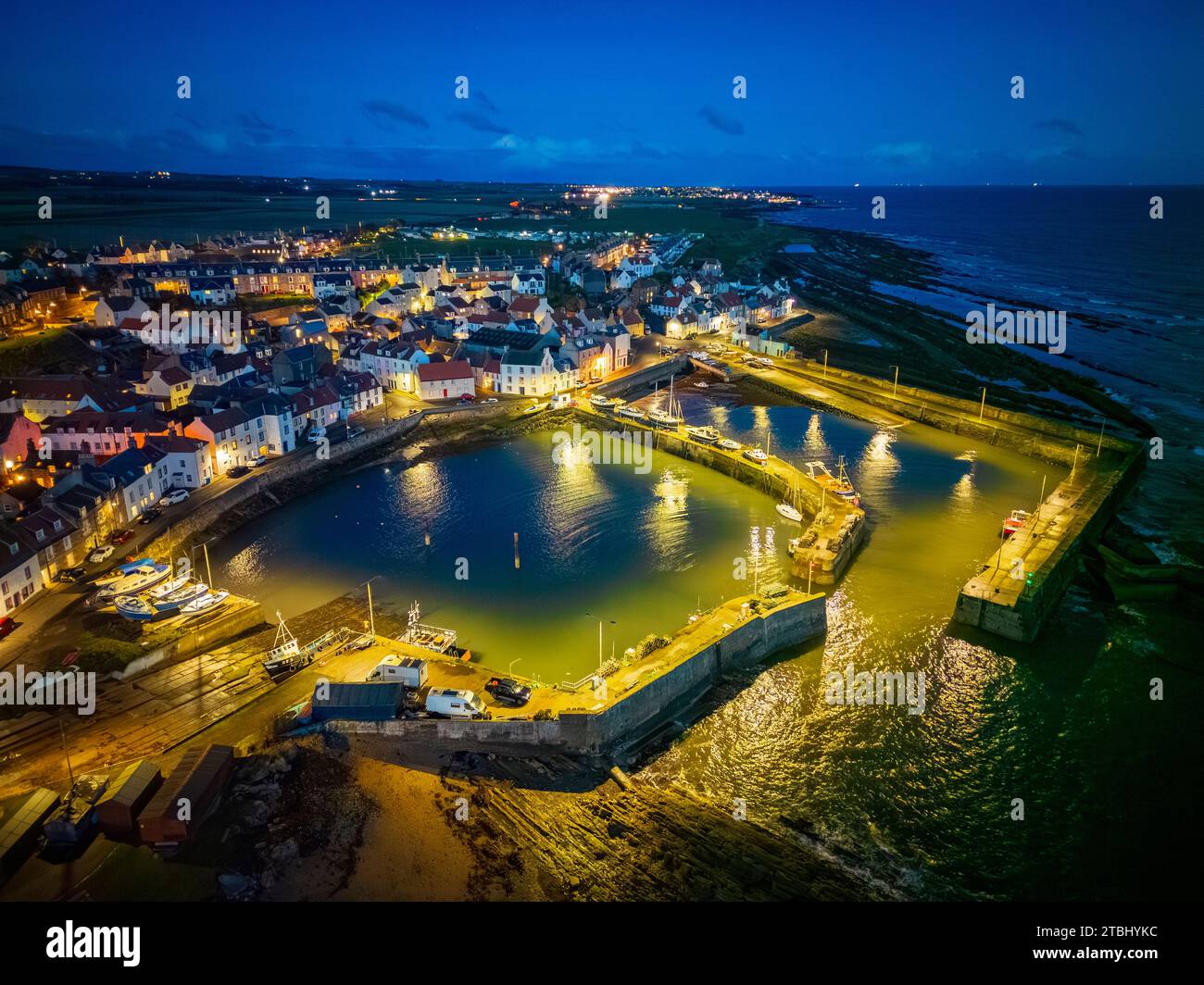 Aerial view at night of St Monans fishing village harbour in East Neuk ...