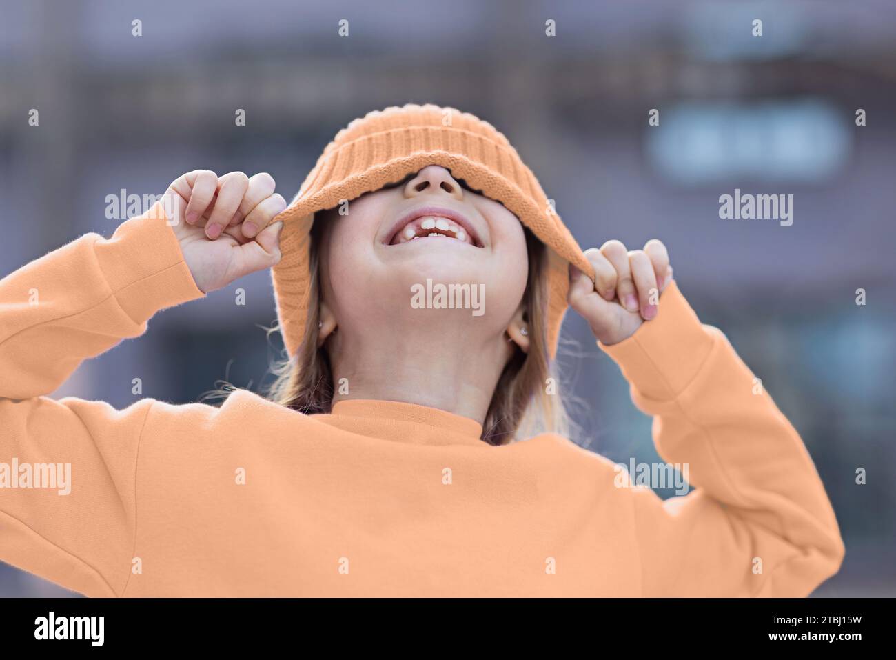 Trendy color of the 2024 year peach fuzz. Cute little caucasian girl ...