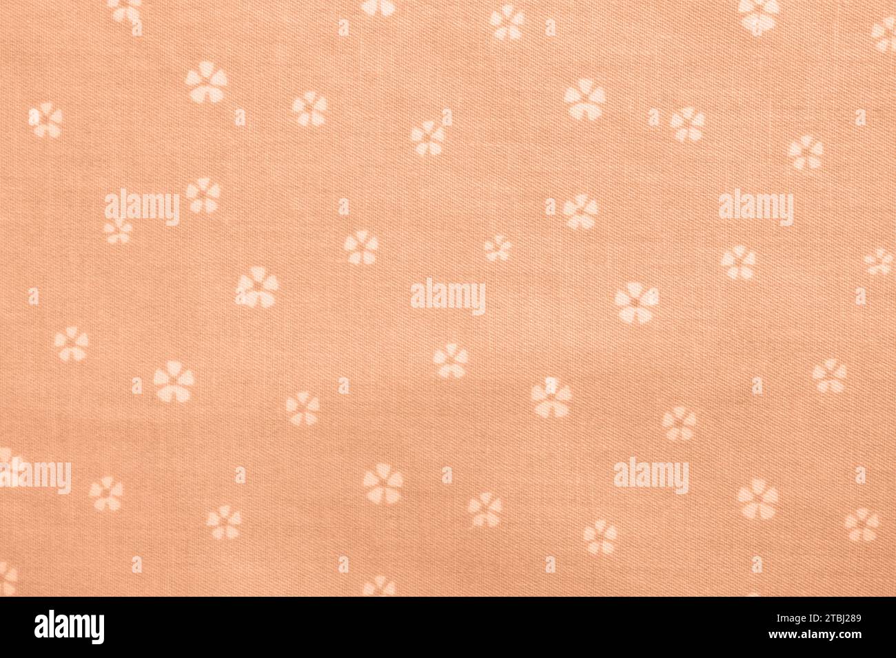 Peach fuzz cotton fabric with small flowers texture. Floral textile ...