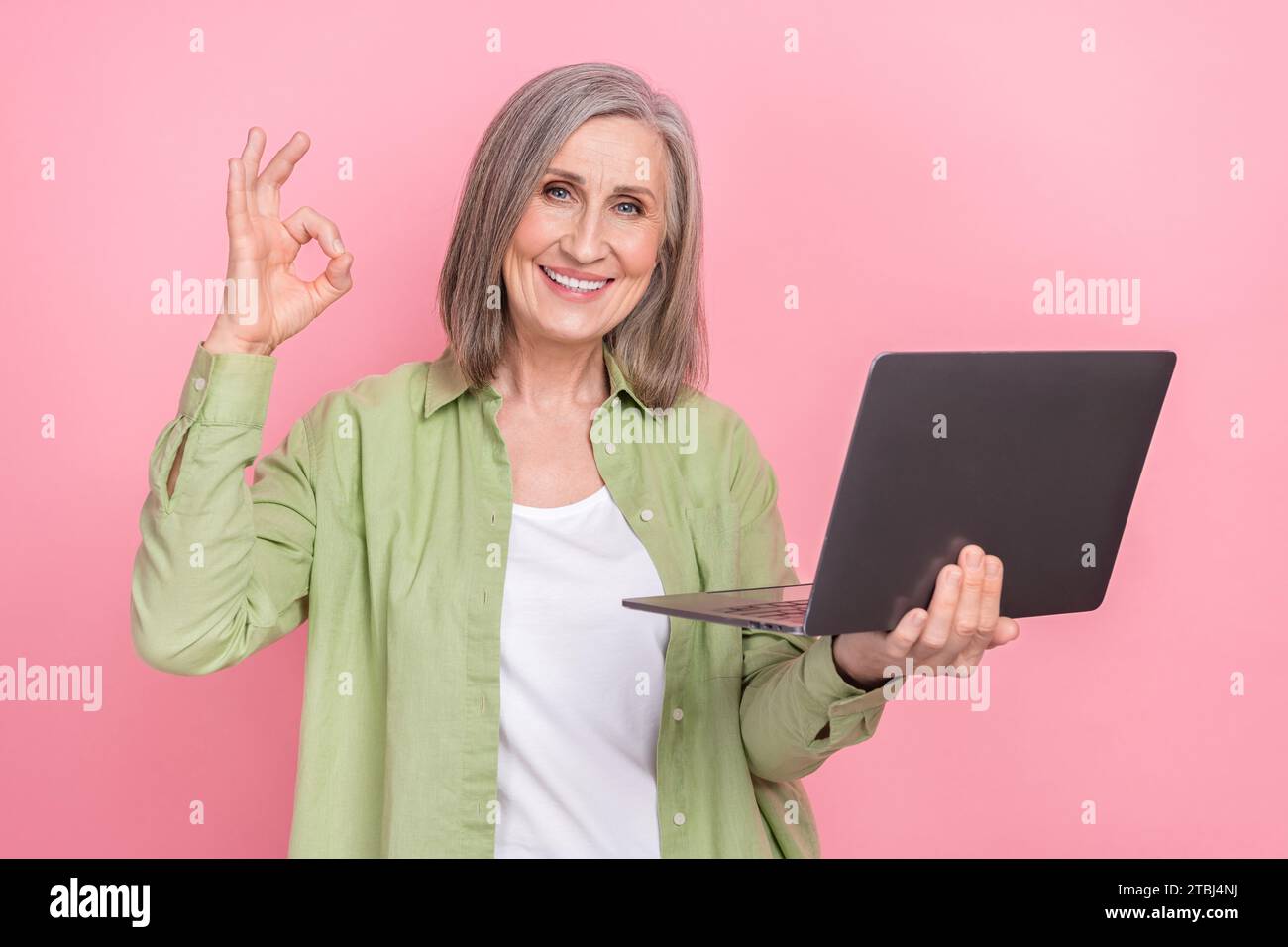 Photo of grandmother buy new modern laptop light weight fast speed ...