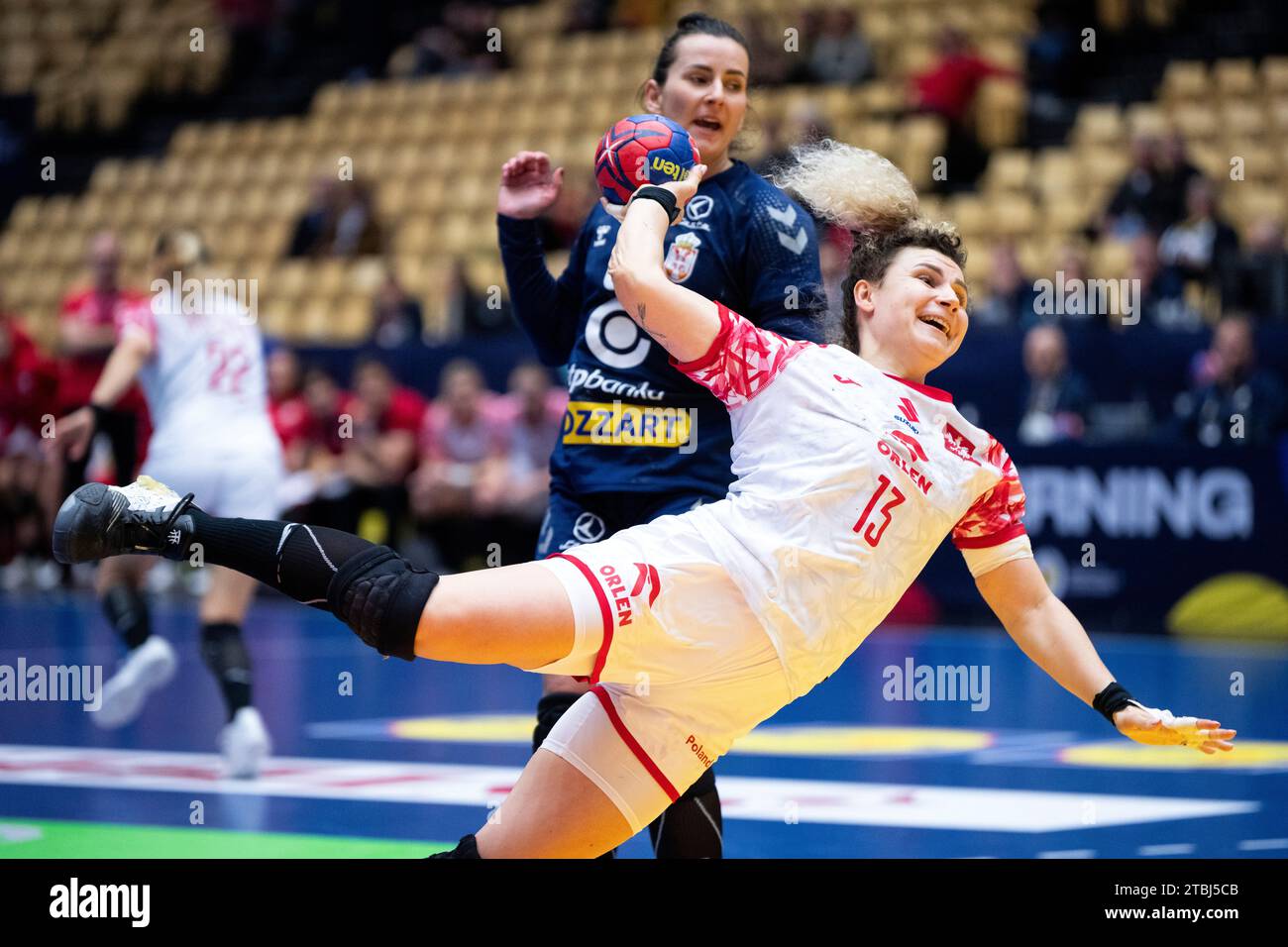 Sylwia Matuszczyk of Poland in action with Jovana Milojevic of Serbia during the IHF World Women ...