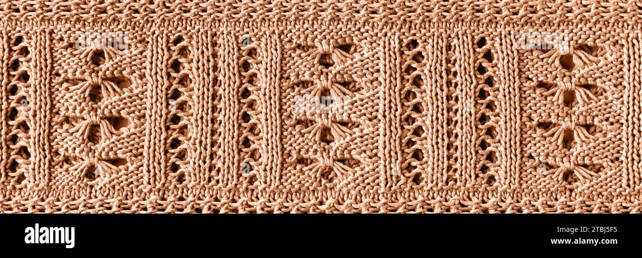 Demonstrating the colors of 2024 - Peach Fuzz. Knitted peach background ...
