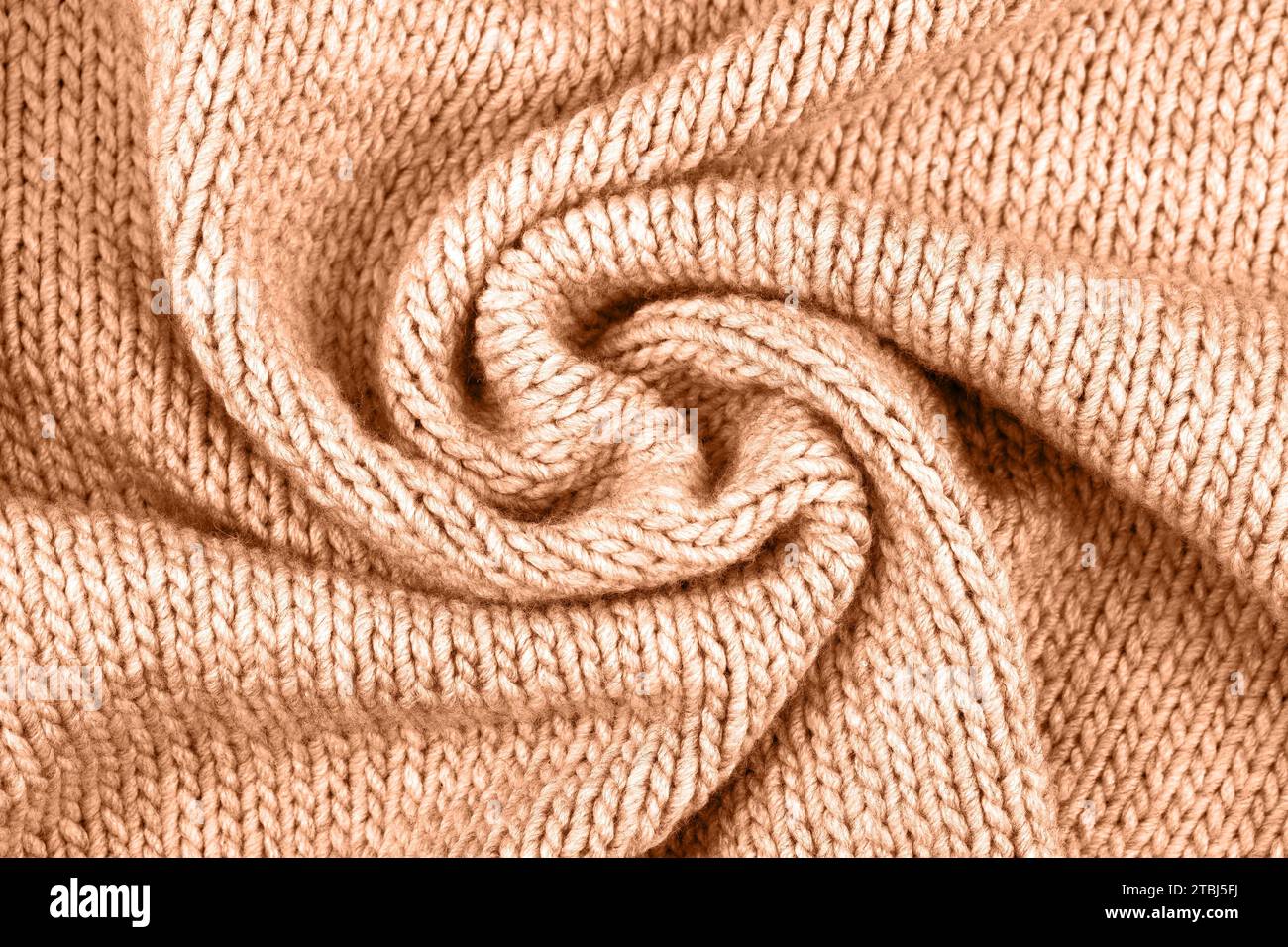 Demonstrating the colors of 2024 - Peach Fuzz. Knitted peach background ...