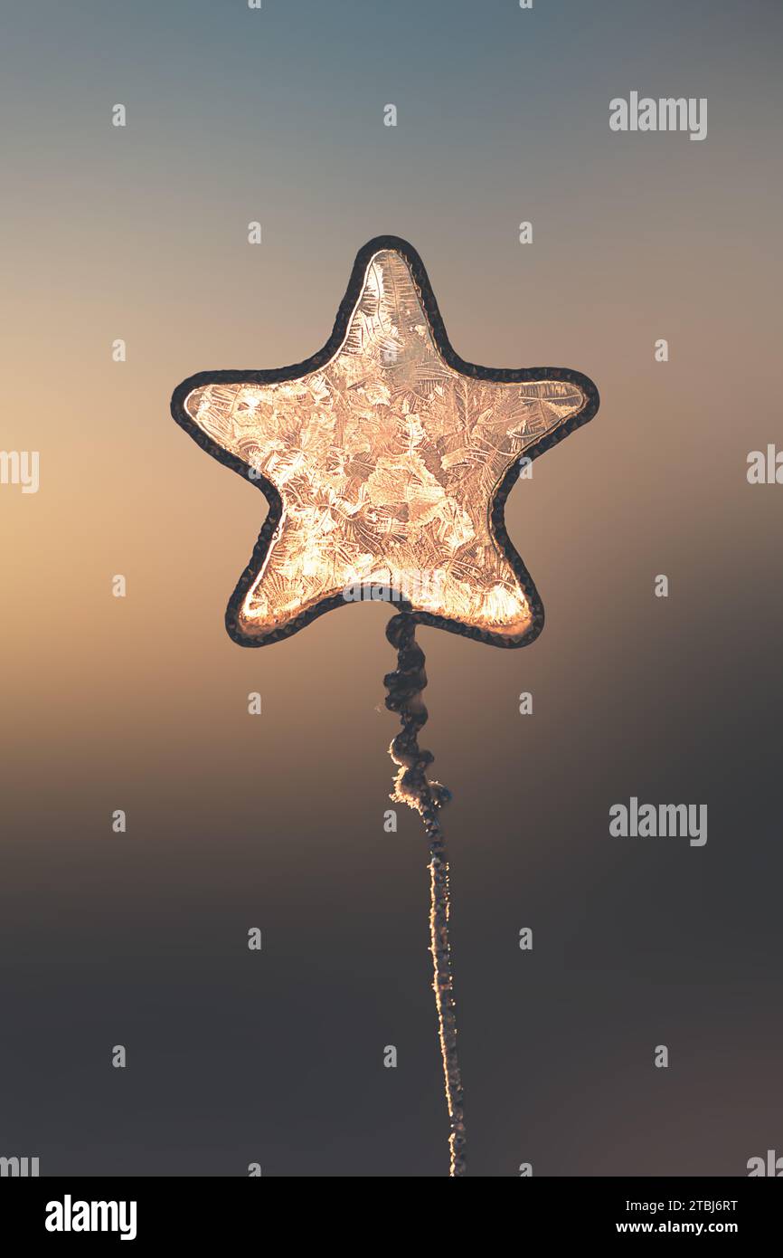 concept winter, frost. beautiful frosty patterns on a star shape, soap ...