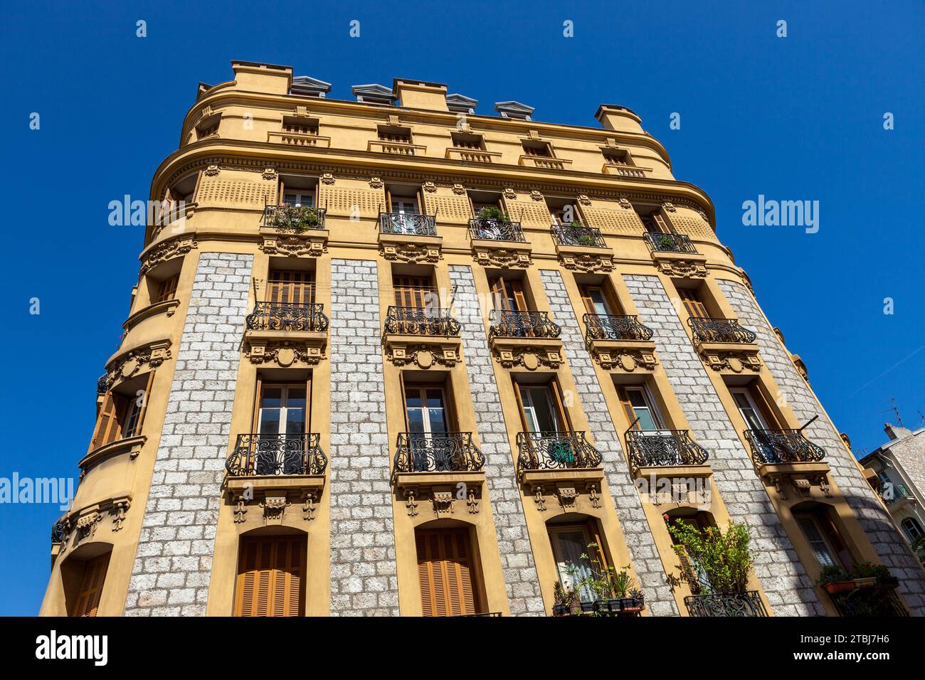 Stone building with wrought iron balconies, Nice, France Stock Photo ...