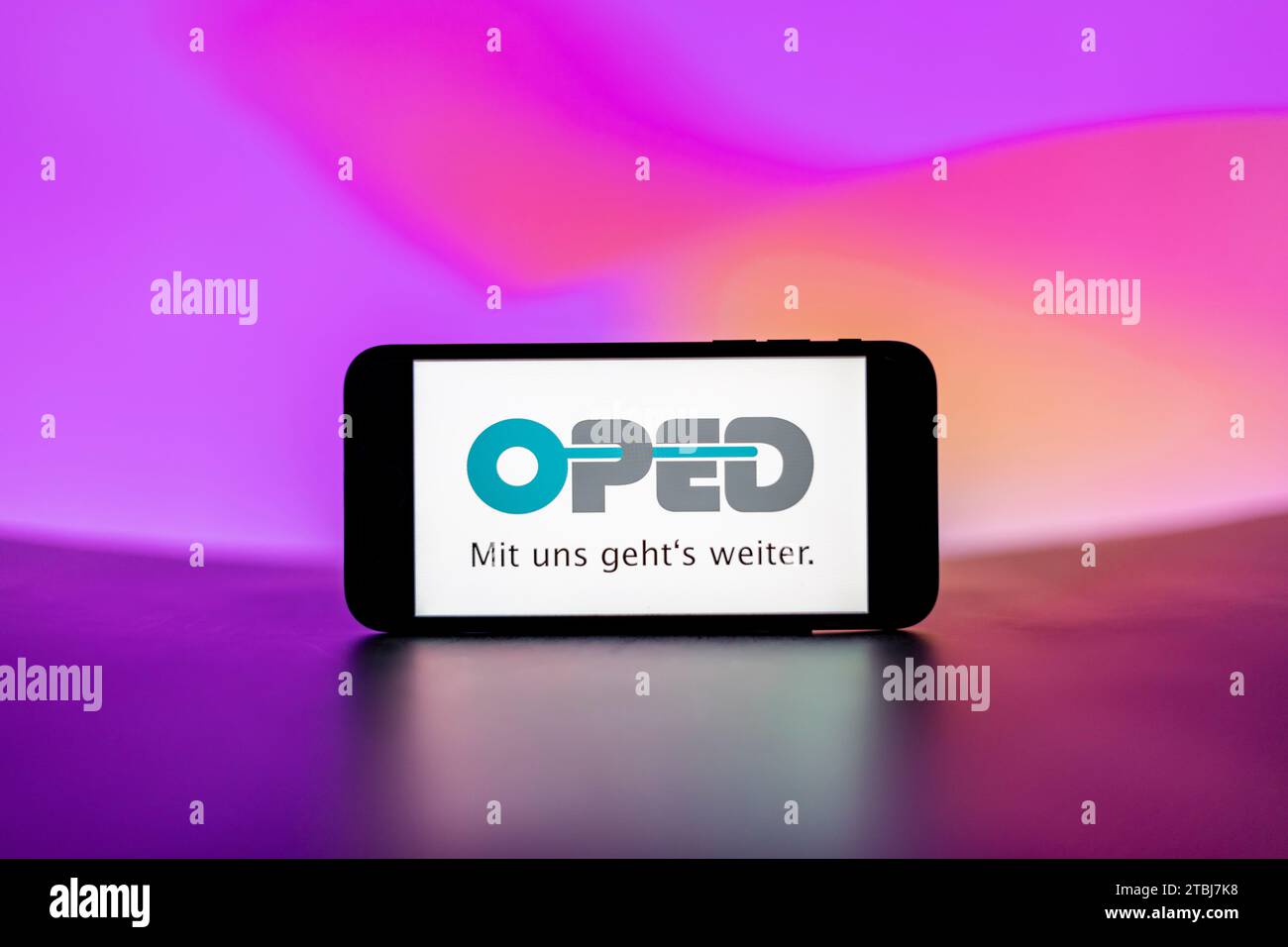 In this photo illustration, the OPED logo is seen displayed on a mobile ...