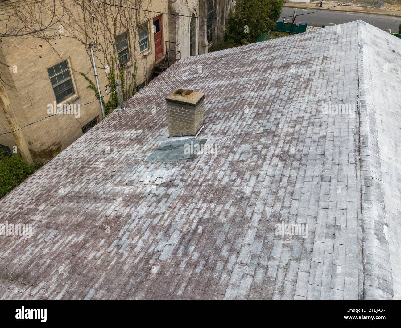 Drone photos of an old roof in need of replacement during an inspection ...
