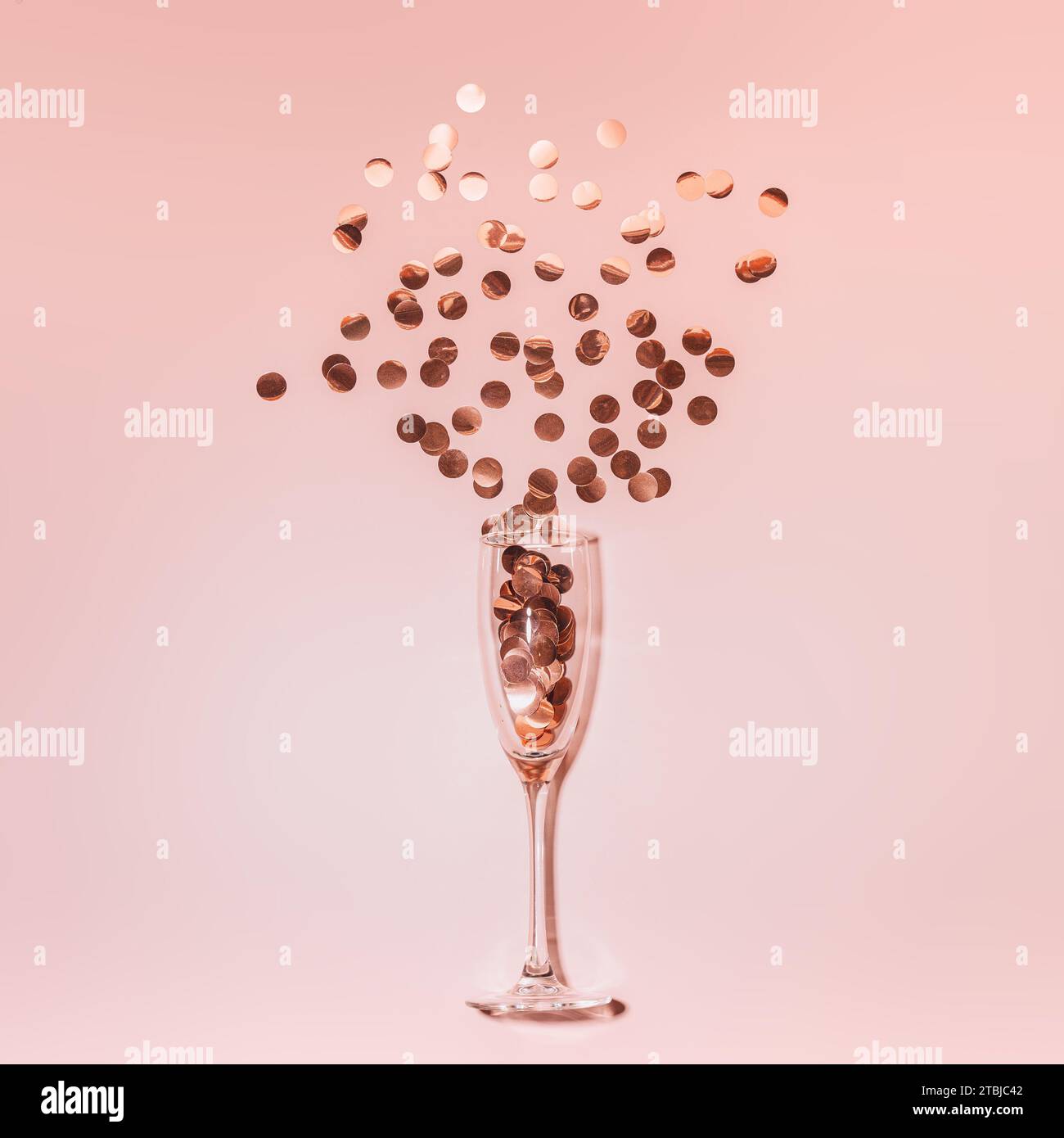 Large round sparkles fly out of a glass against a pink background Stock ...