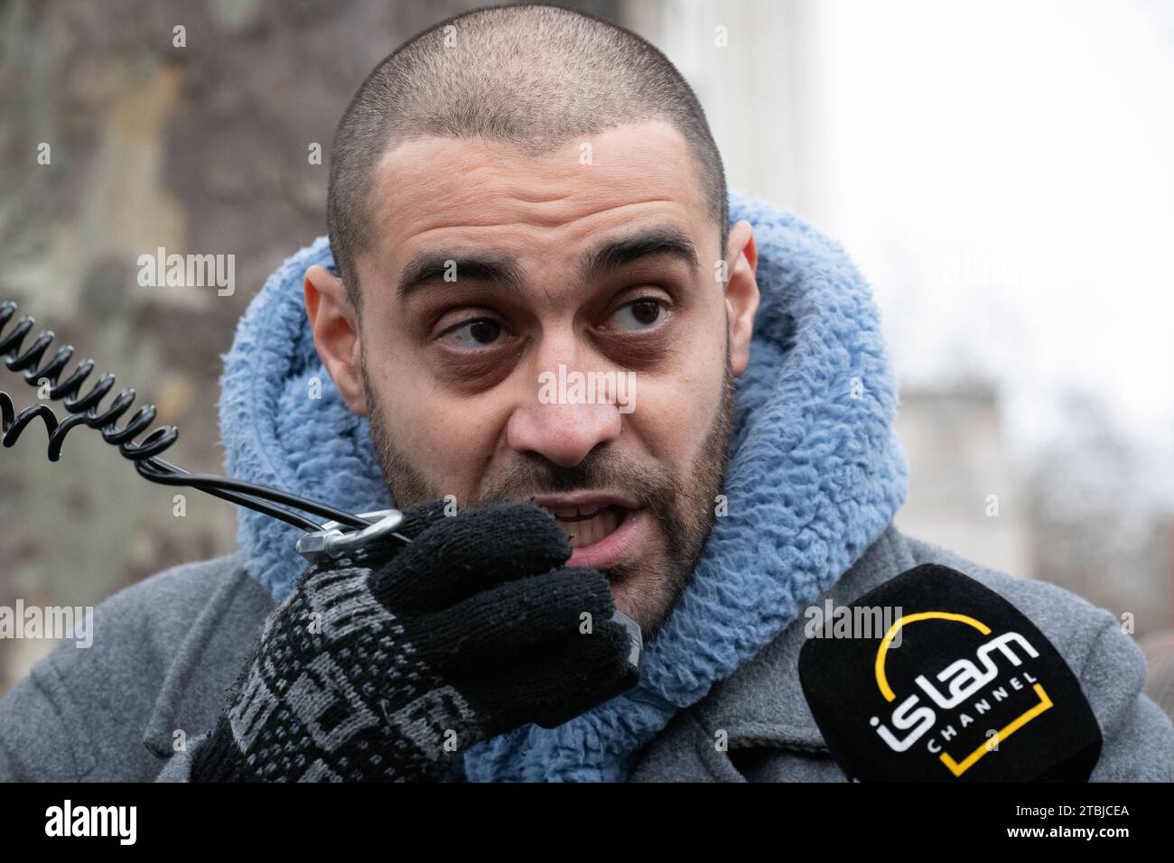 London, UK. 7 December, 2023. Rapper and activist Lowkey addresses ...
