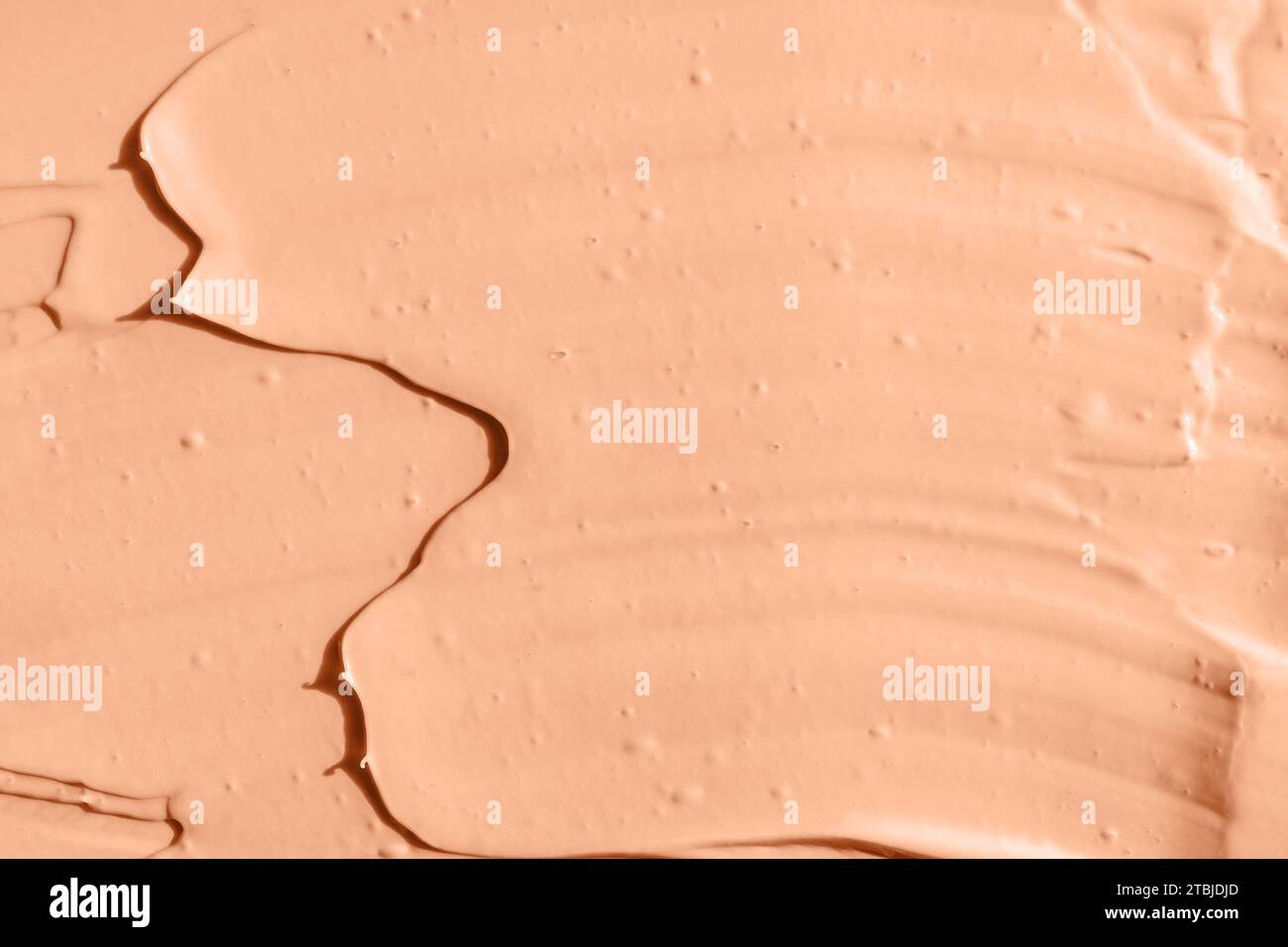 Peach color cosmetic, paint or clay texture close-up, abstract ...