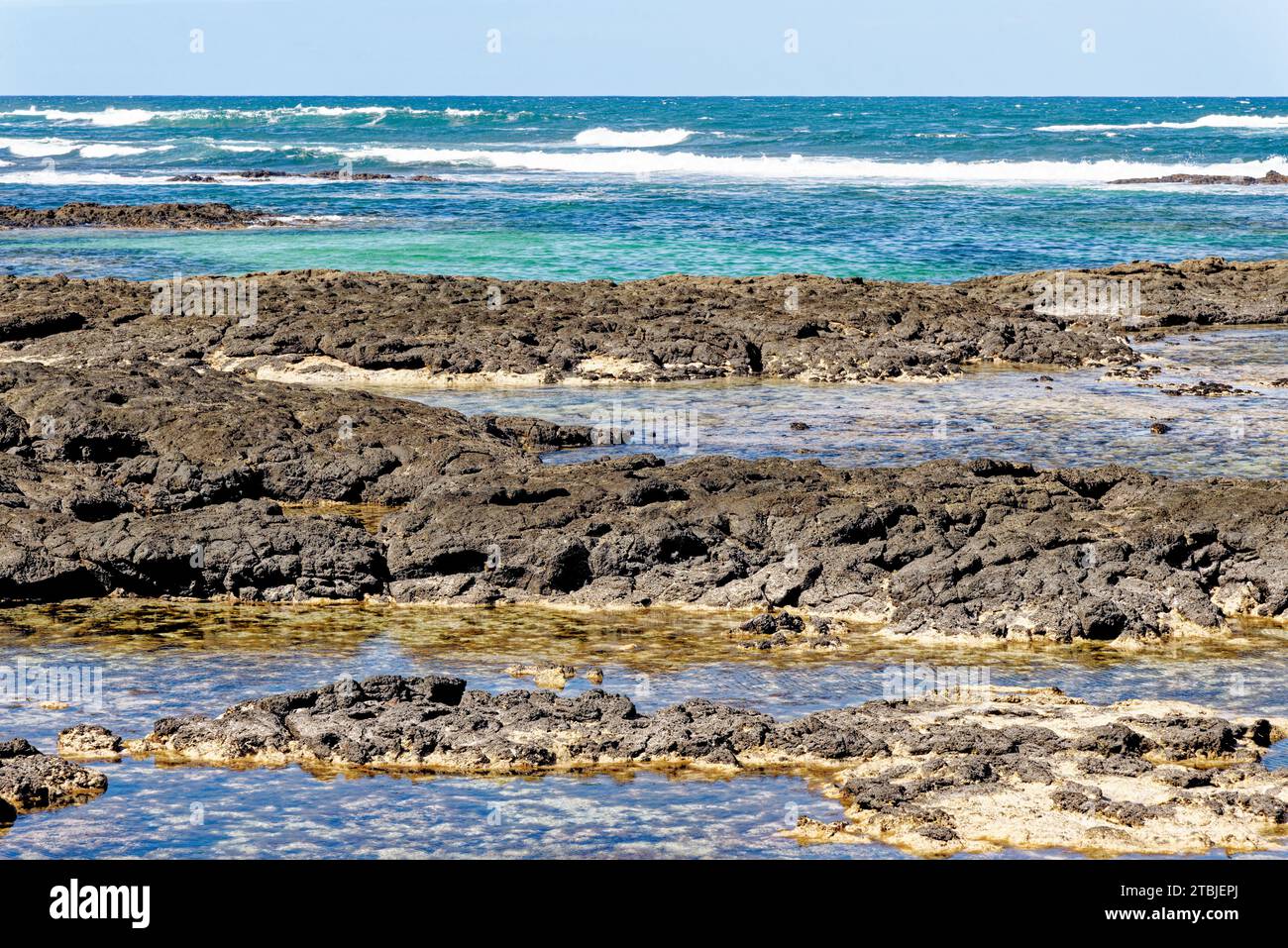 Aerial view of Natural tidal pools of The Playa de los Charcos beach ...