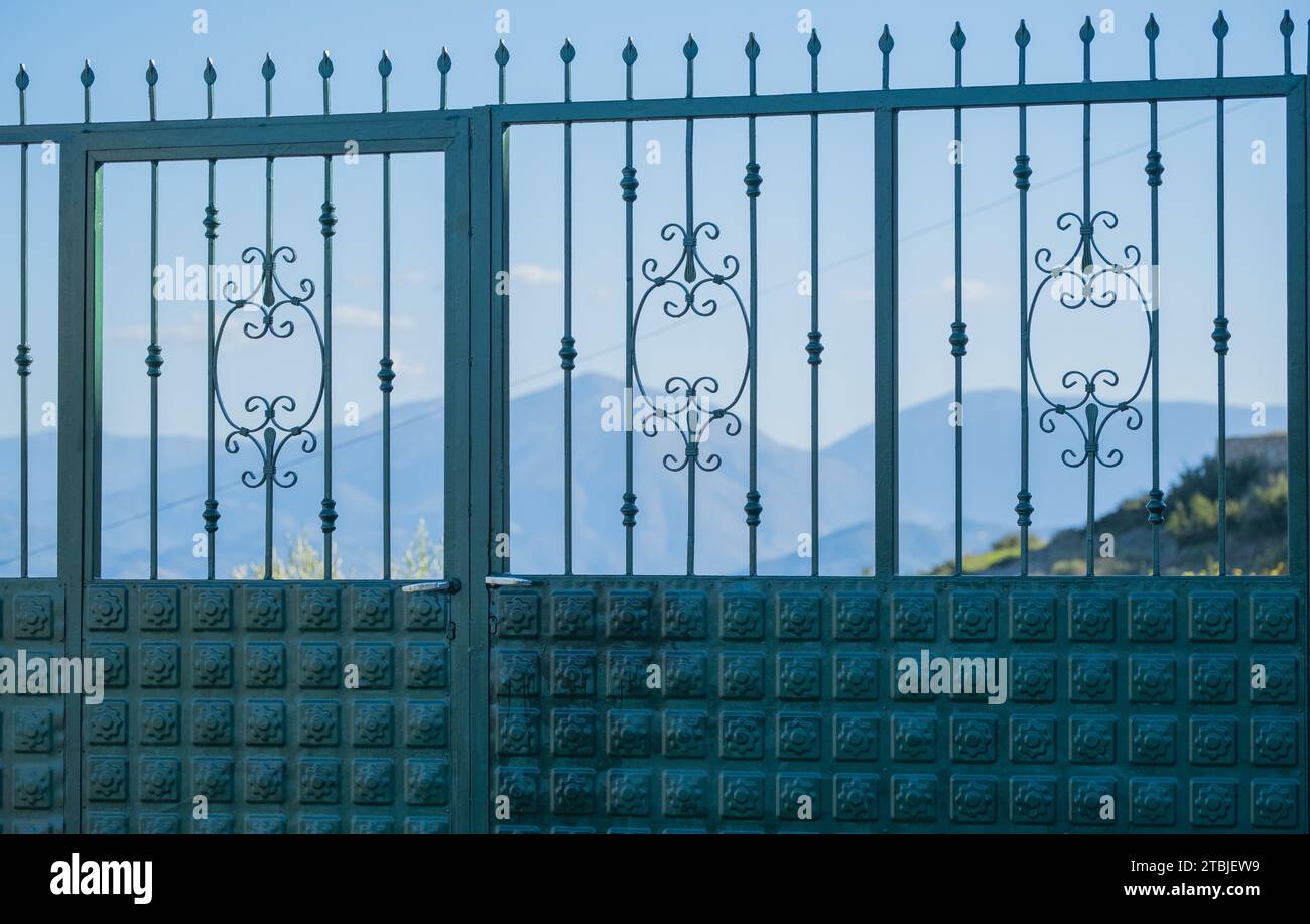 Metal Green gate near beautiful estate on sunny day in Saranda Albania ...