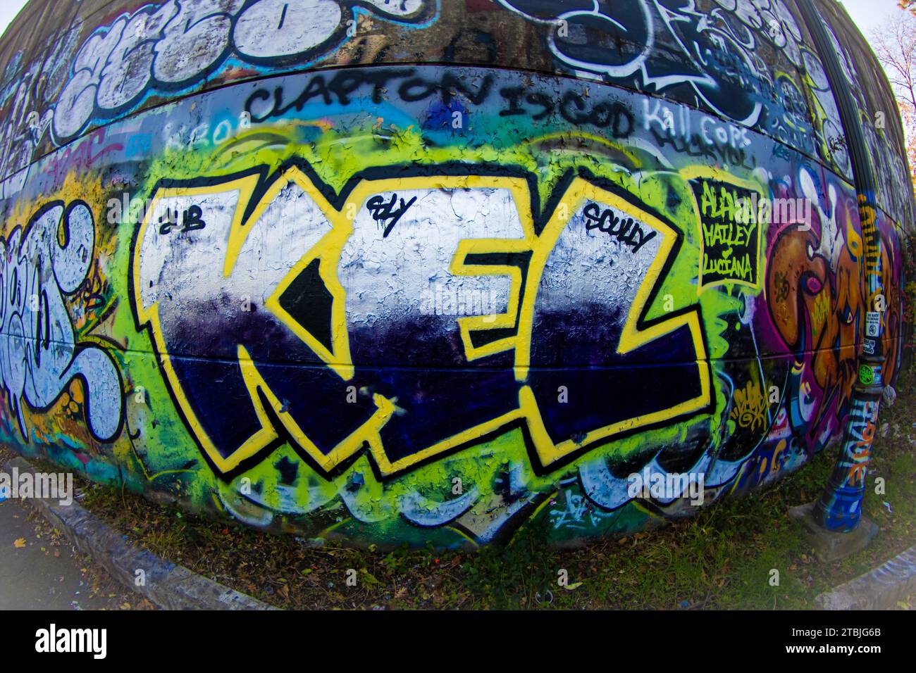 An aerial view of a peculiar spherical object covered in graffiti ...