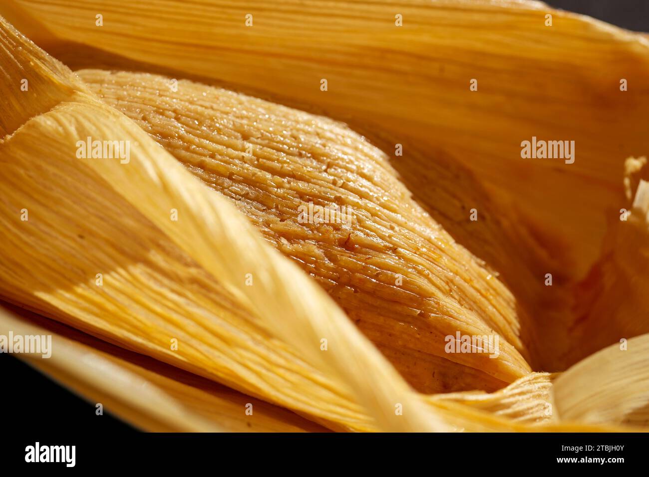 a tamale, the classic of Mexican street food, open and ready to eat ...