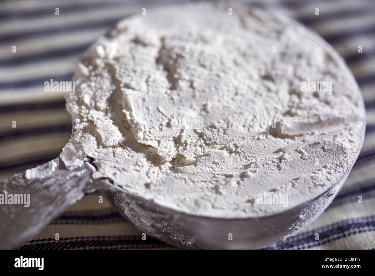 All purpose flour in a measuring cup Stock Photo - Alamy