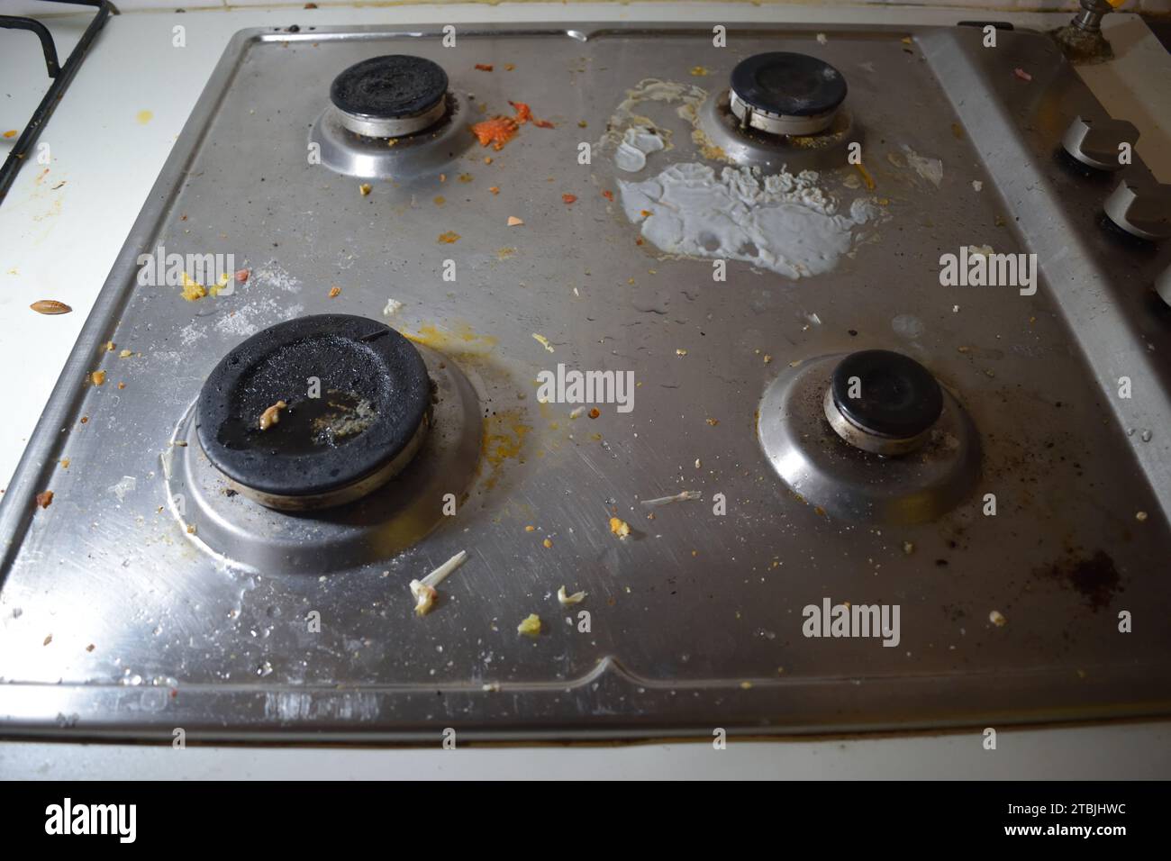 non edited photo of Dirty stove in the kitchen with food leftovers ...