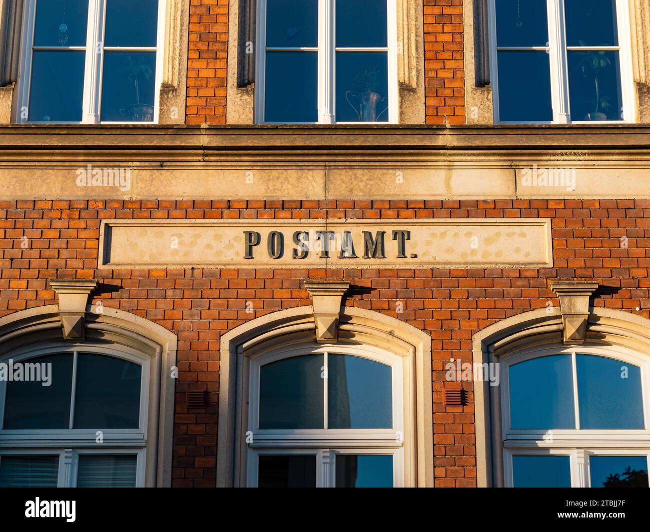 Postamt (post office) sign on an old building exterior. The letters are ...