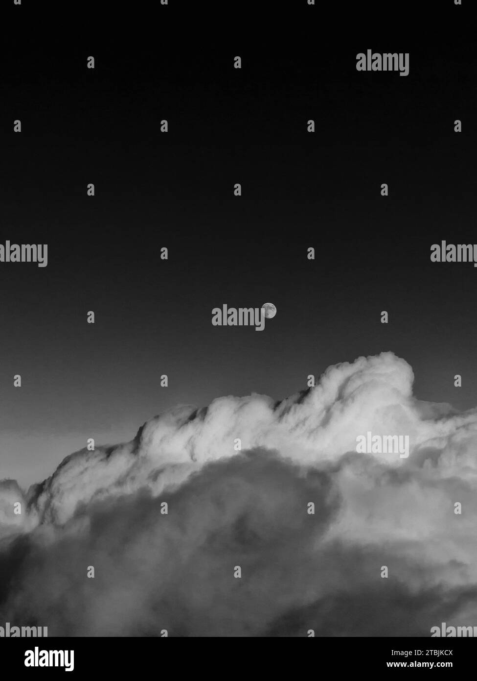 Moon above clouds Stock Photo - Alamy