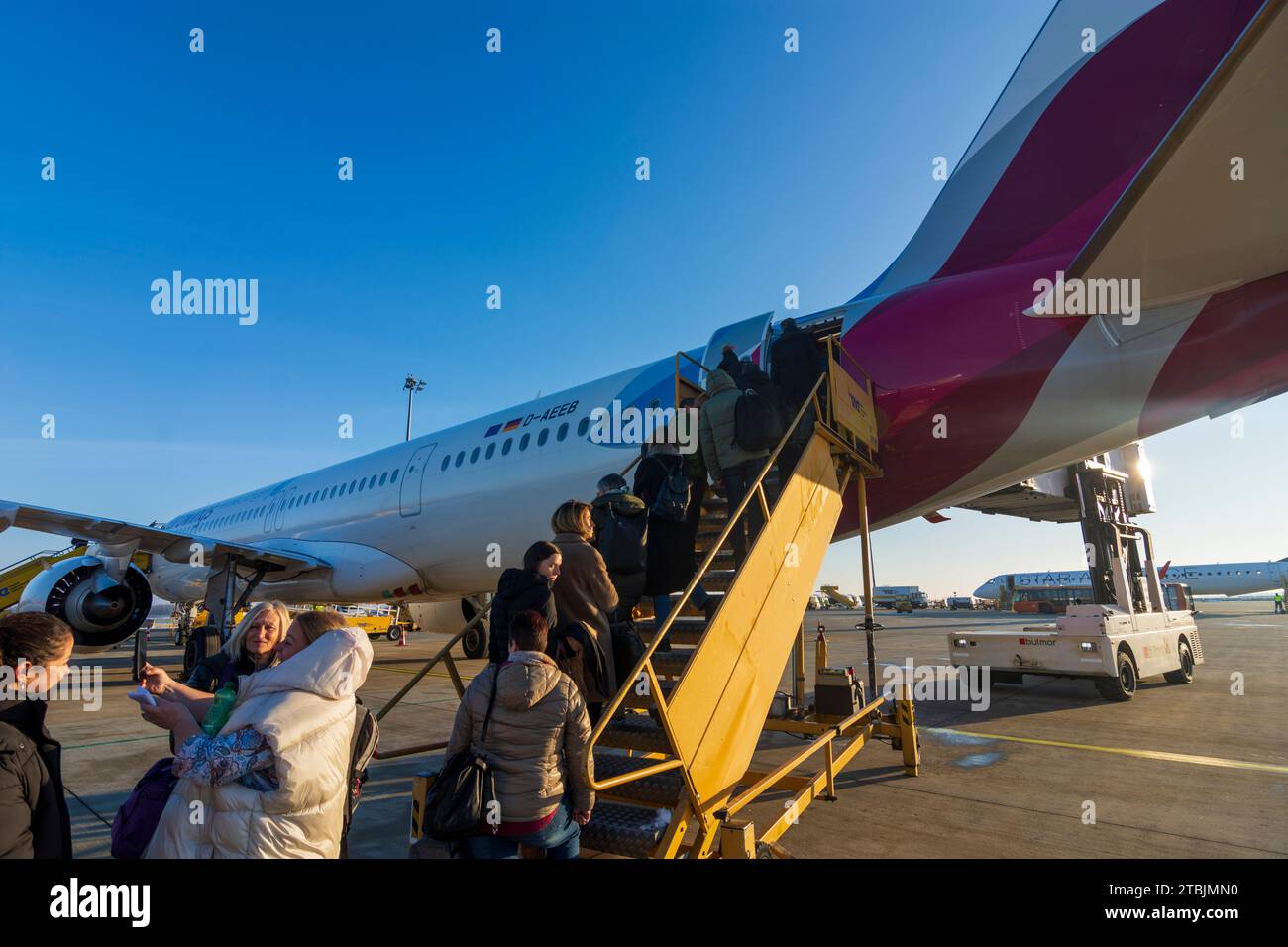 Schwechat: aircraft of Eurowings at airport Wien- Schwechat, passengers ...