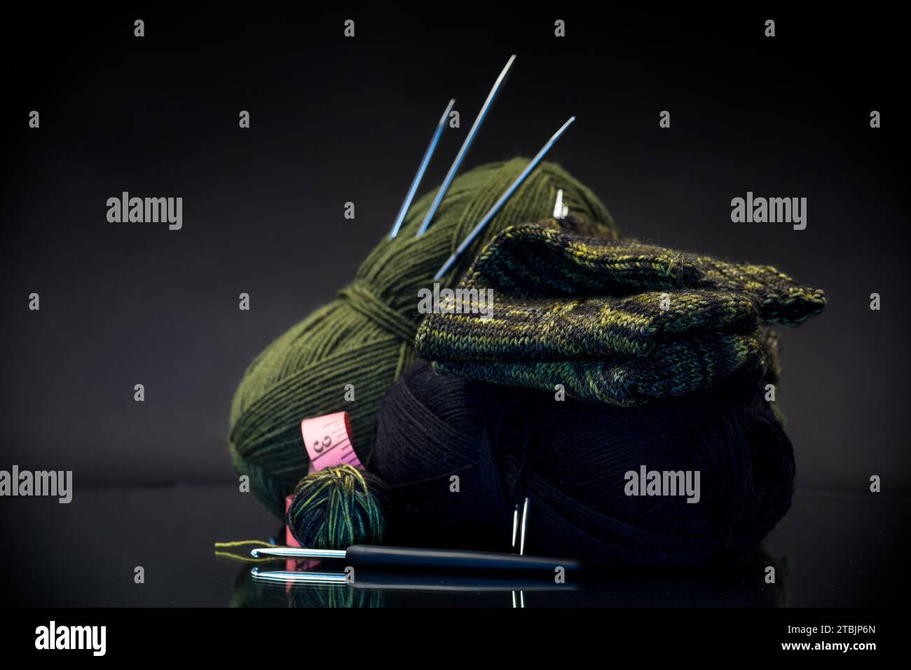 wool yarn, knitting needles and other tools for hand knitting, isolated ...