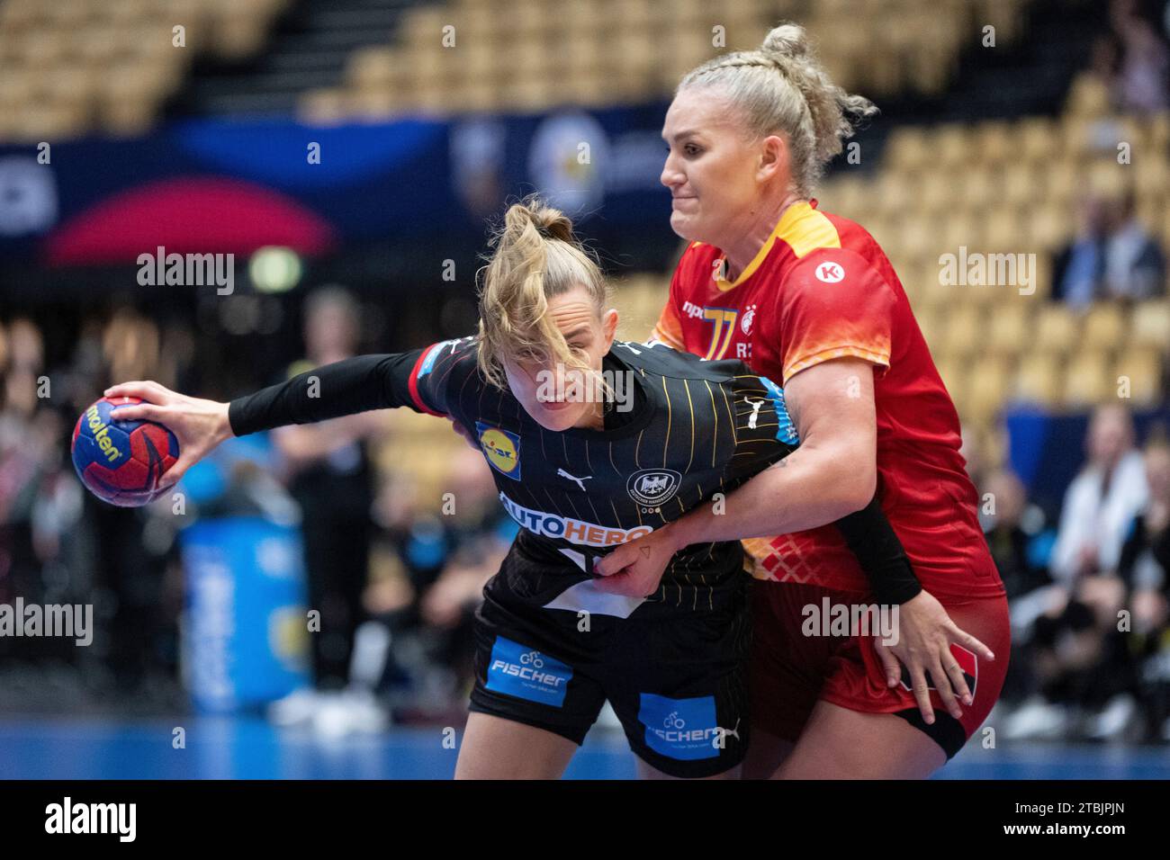 Annika Lott of Germany in action with Crina Pintea of Romania during the IHF World Women's ...