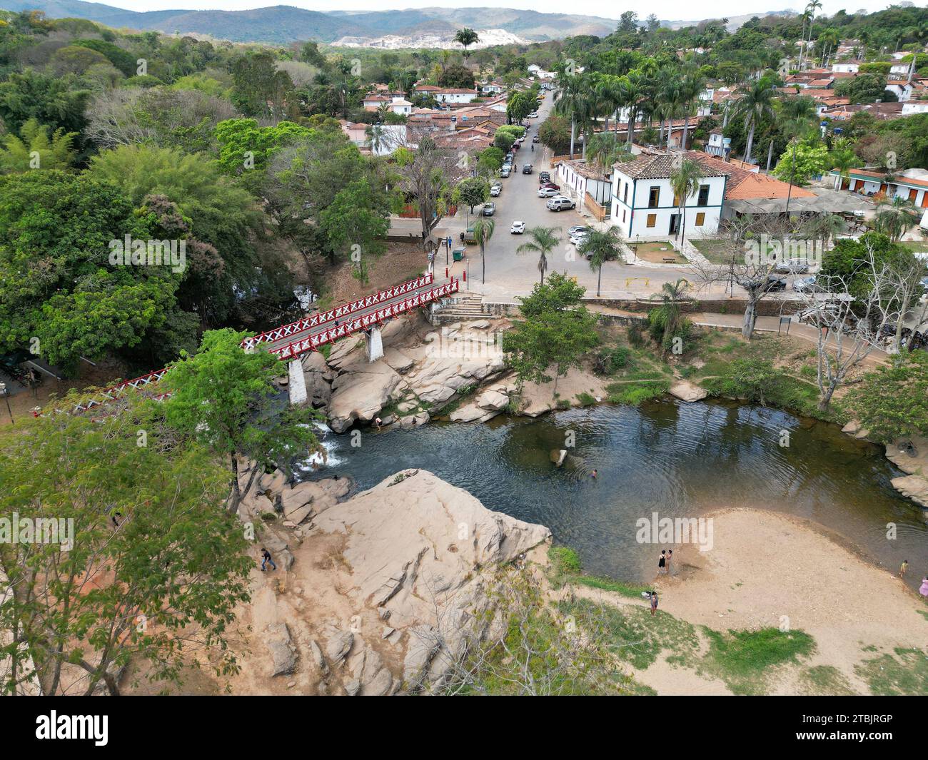 Aerial view of a small town with a bridge spanning the water, from a ...