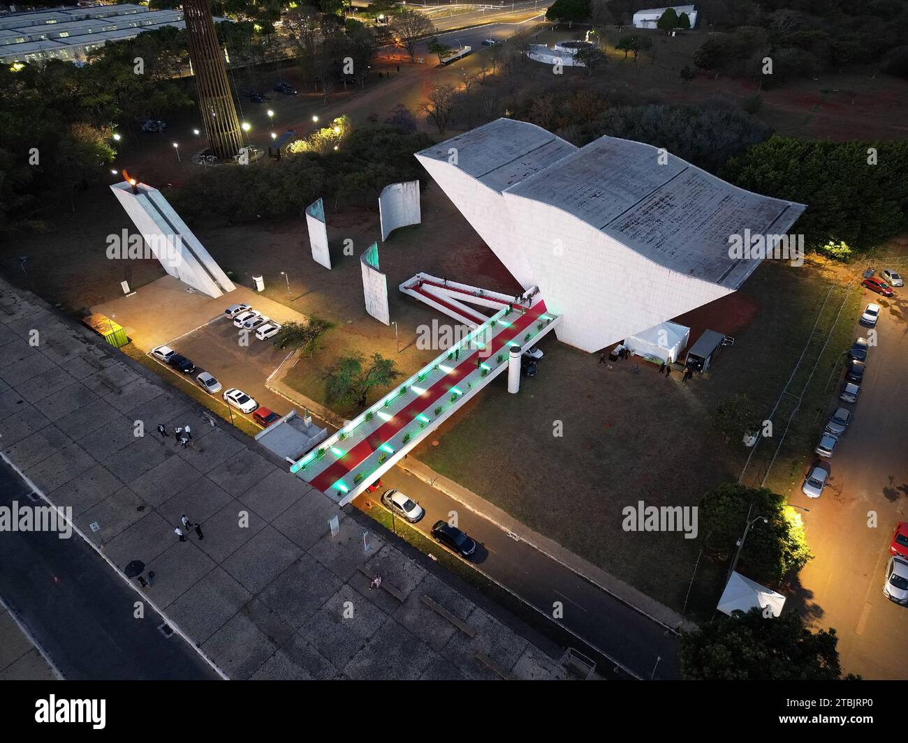 An aerial shot of an expansive parking lot with a multicolored walkway ...