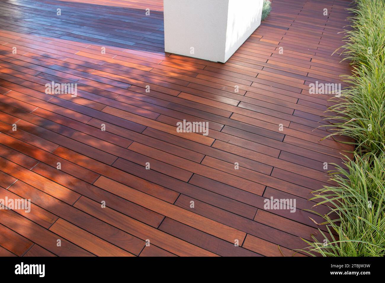 Ipe hardwood deck boards patio, idea with evergreen grass on side of ...