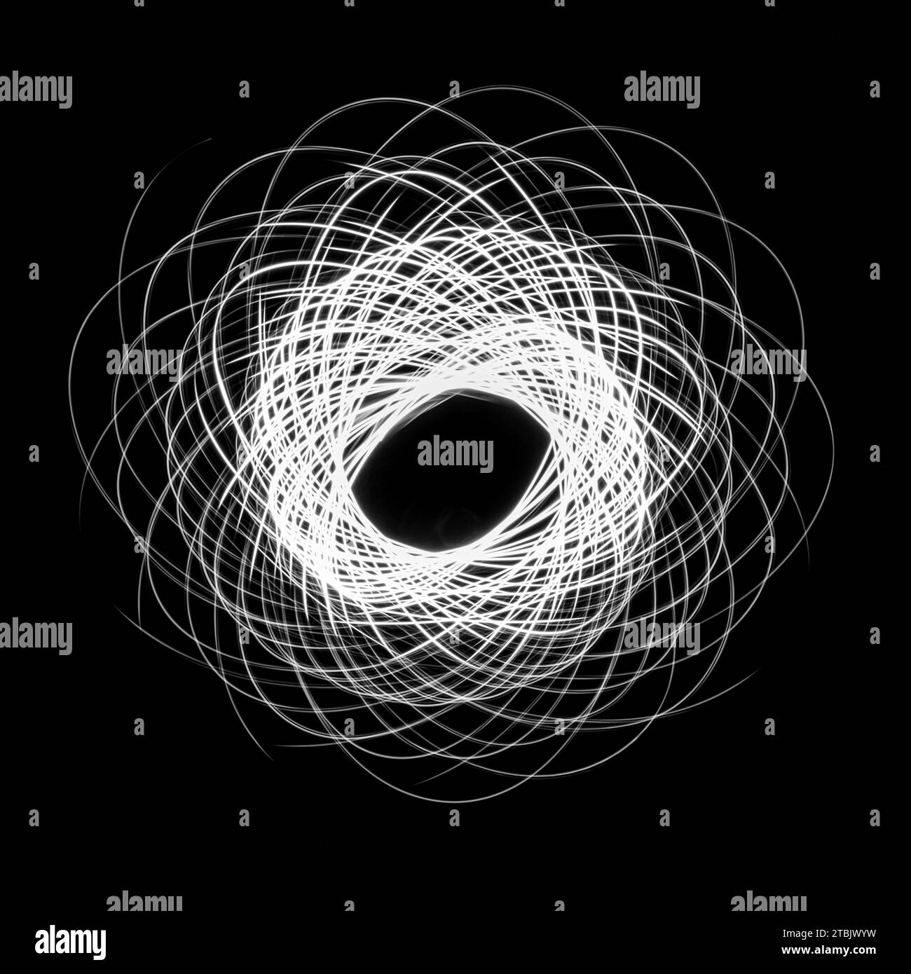 White spirographs photography with light painting on black background ...