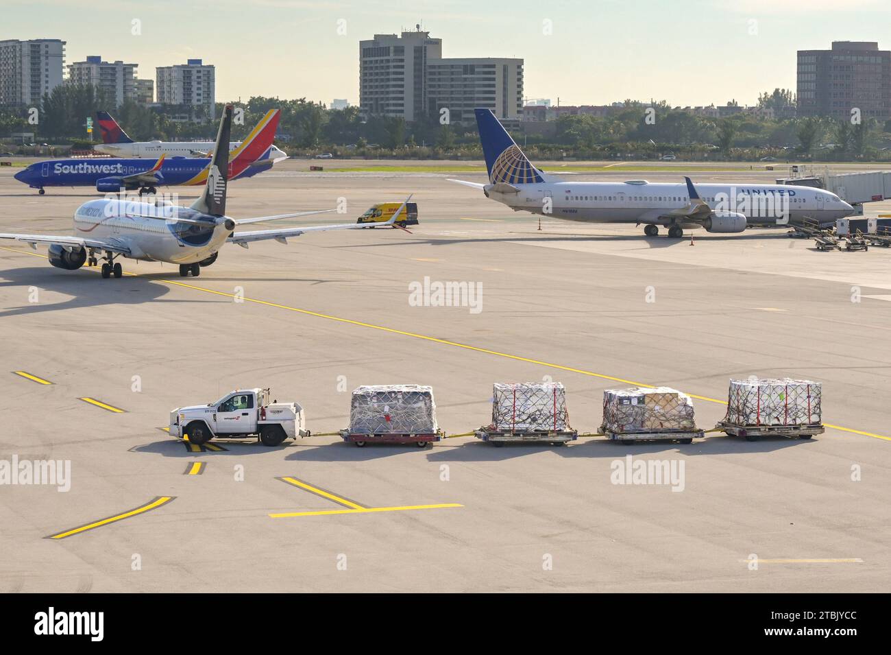 Miami, Florida, USA - 4 December 2023: Truck towing trailers with air ...