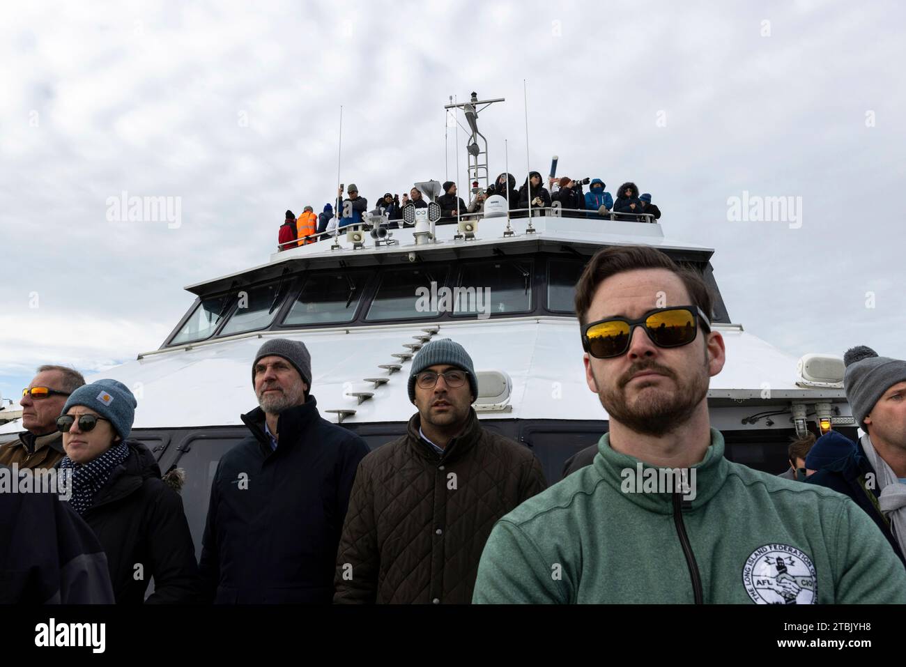 Guests observe the first operating South Fork Wind farm turbine ...