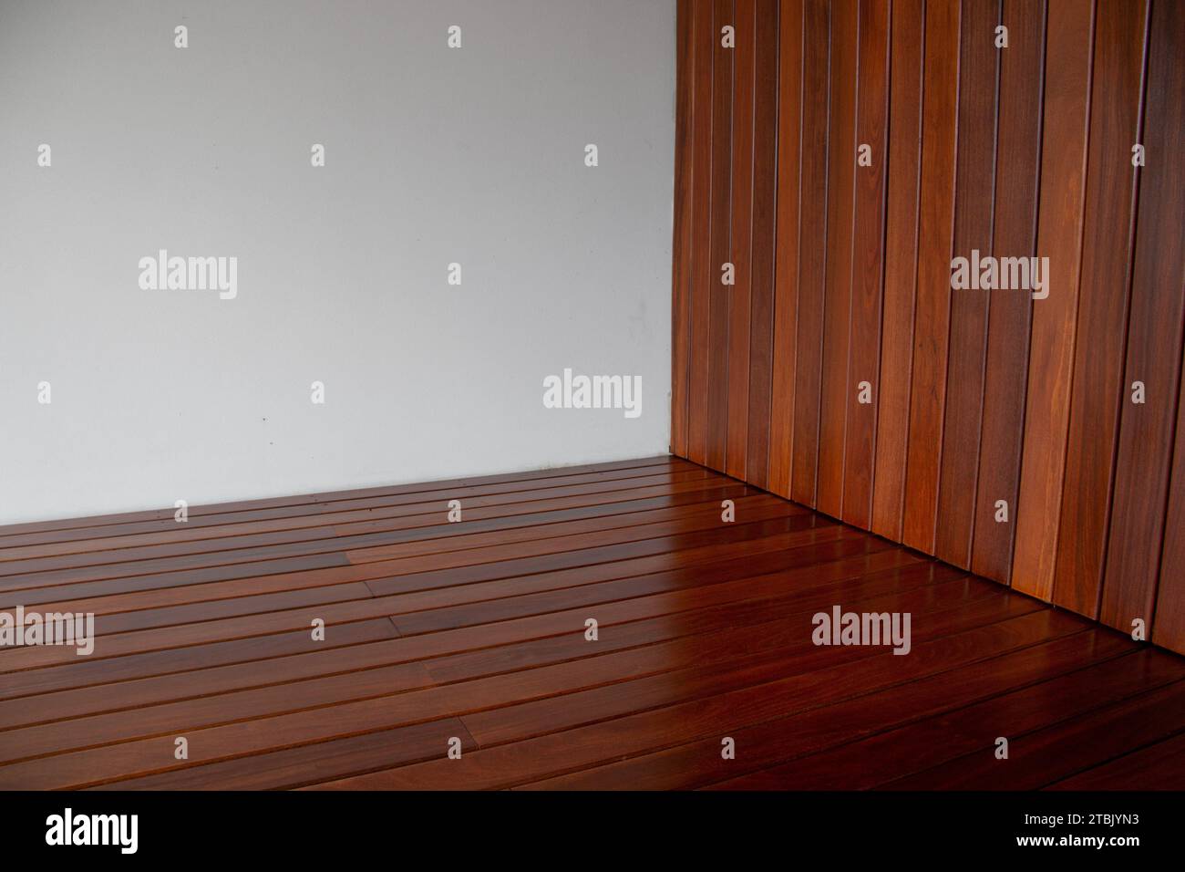 Hardwood flooring, indoor ipe wood floor and cladding with white wall ...