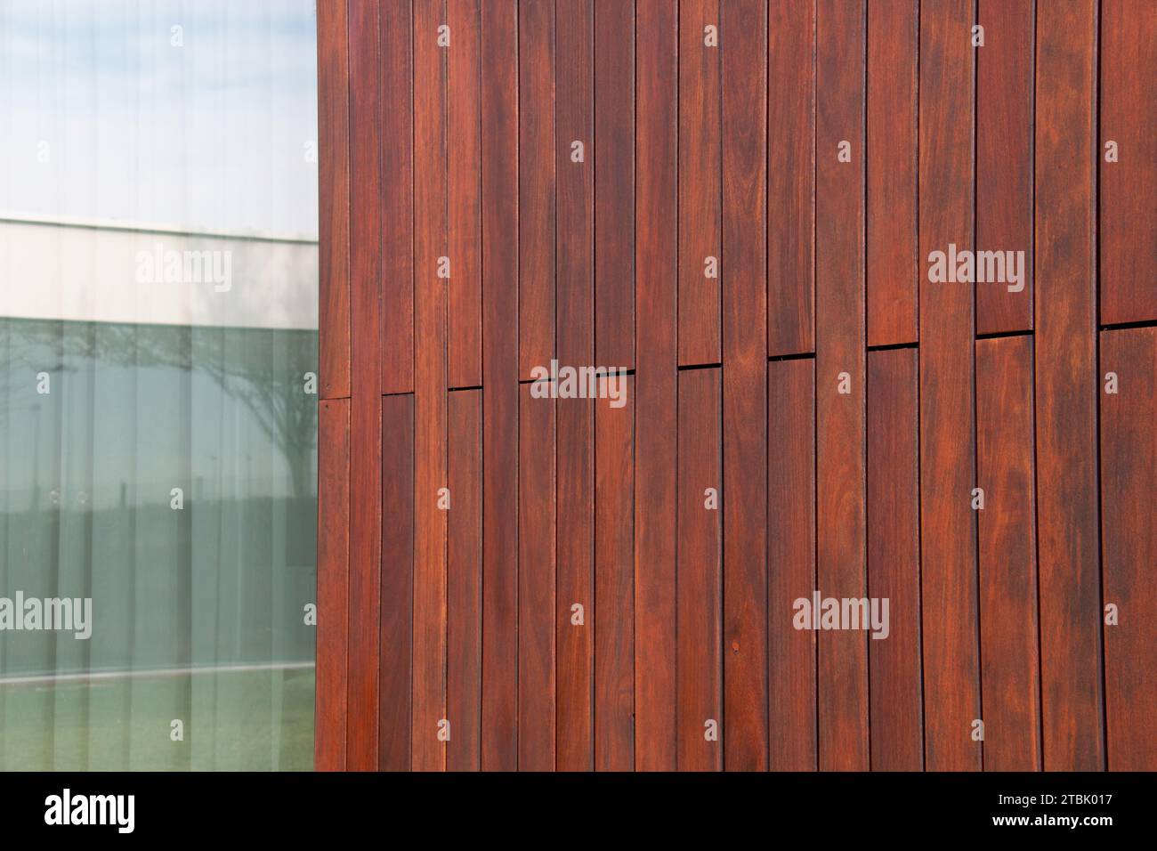 Modern wooden facade with large glass window detail, top architecture ...