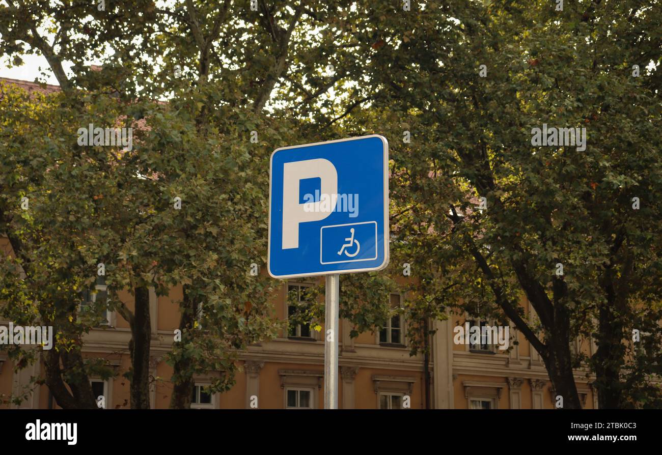 Parking zone sign with wheelchair for handicapped people. Blue european ...