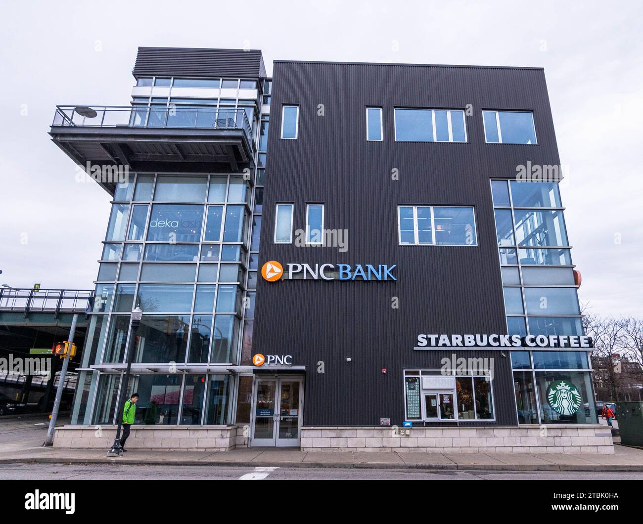 A modern building that houses a PNC bank branch office and a Starbucks ...