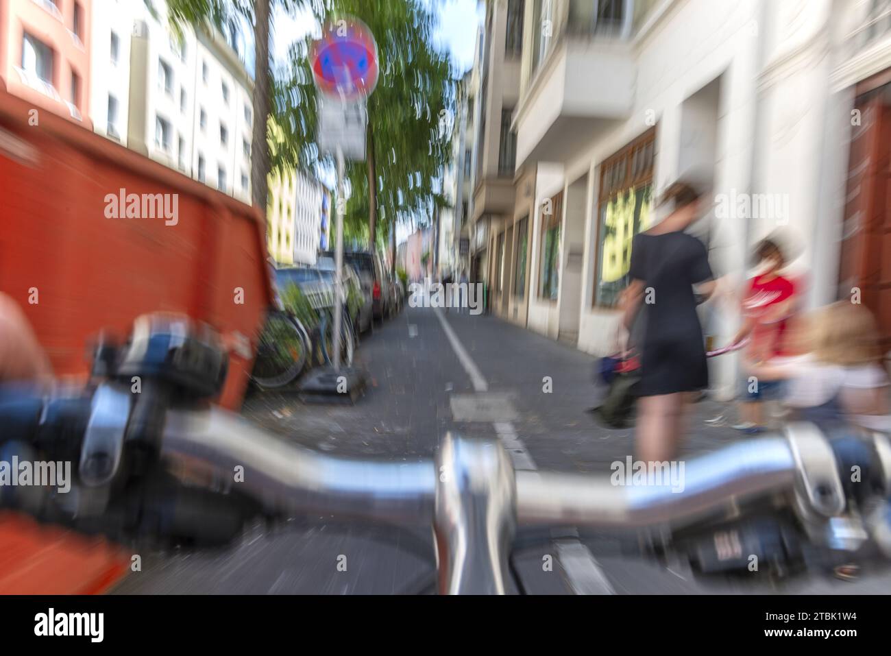 Cycling from the first person perspective on a cycle path in Cologne ...