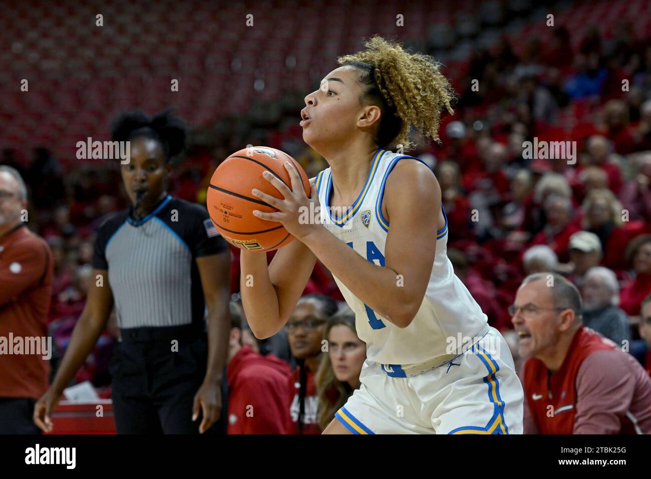 UCLA guard Kiki Rice (1) shoots over an Arkansas defender during an ...
