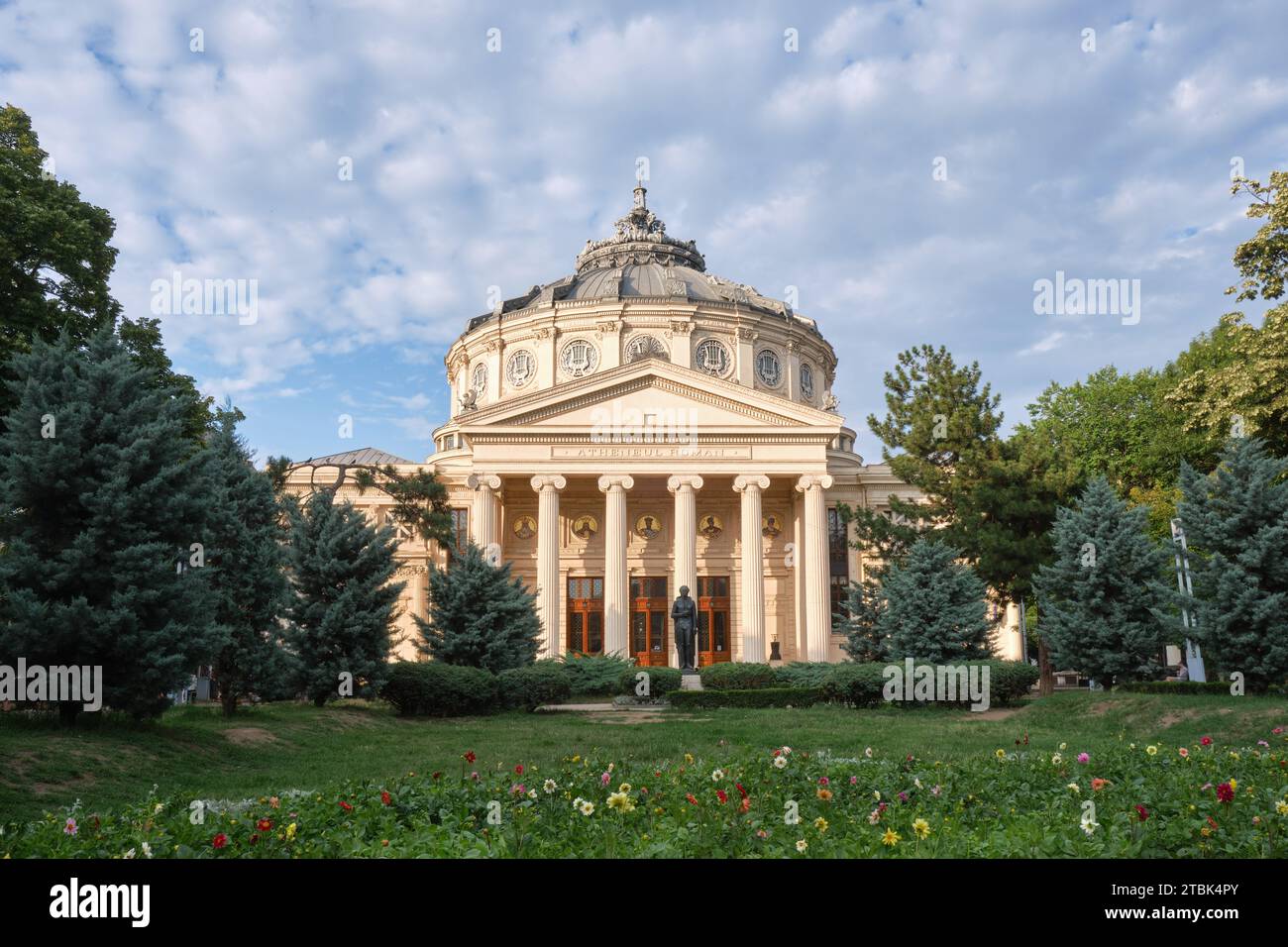 Romanian Athenaeum (Ateneul Roman) domed, circular concert hall building at evening with clouds ...