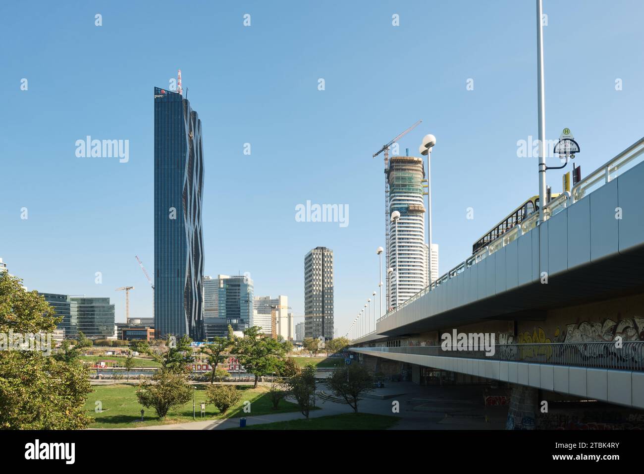 Vienna modern business skyscrapers with construction cranes, near Reichsbrucke (Imperial bridge ...